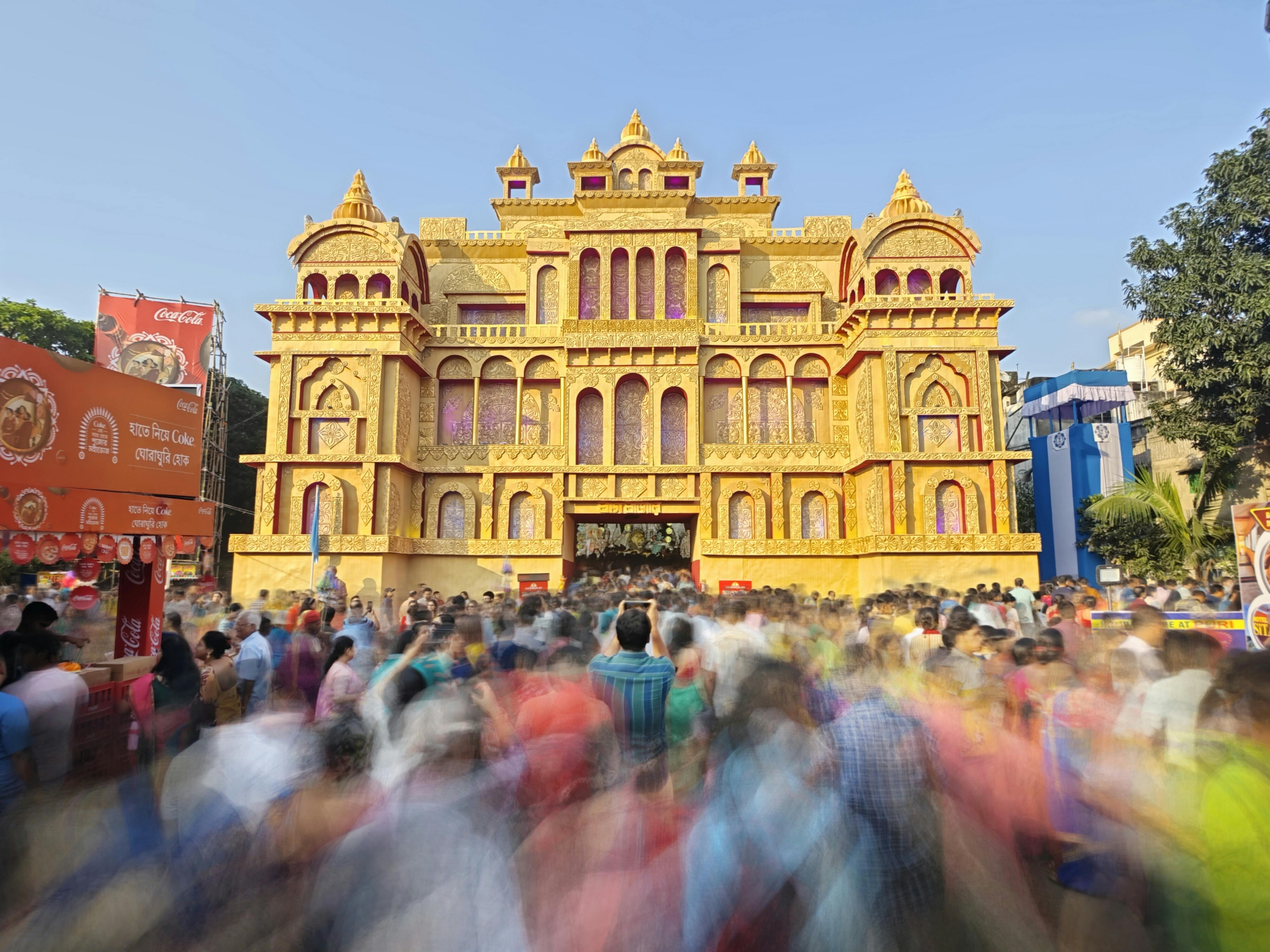 Blurred Crowd in Front of a Golden Temple · Free Stock Photo