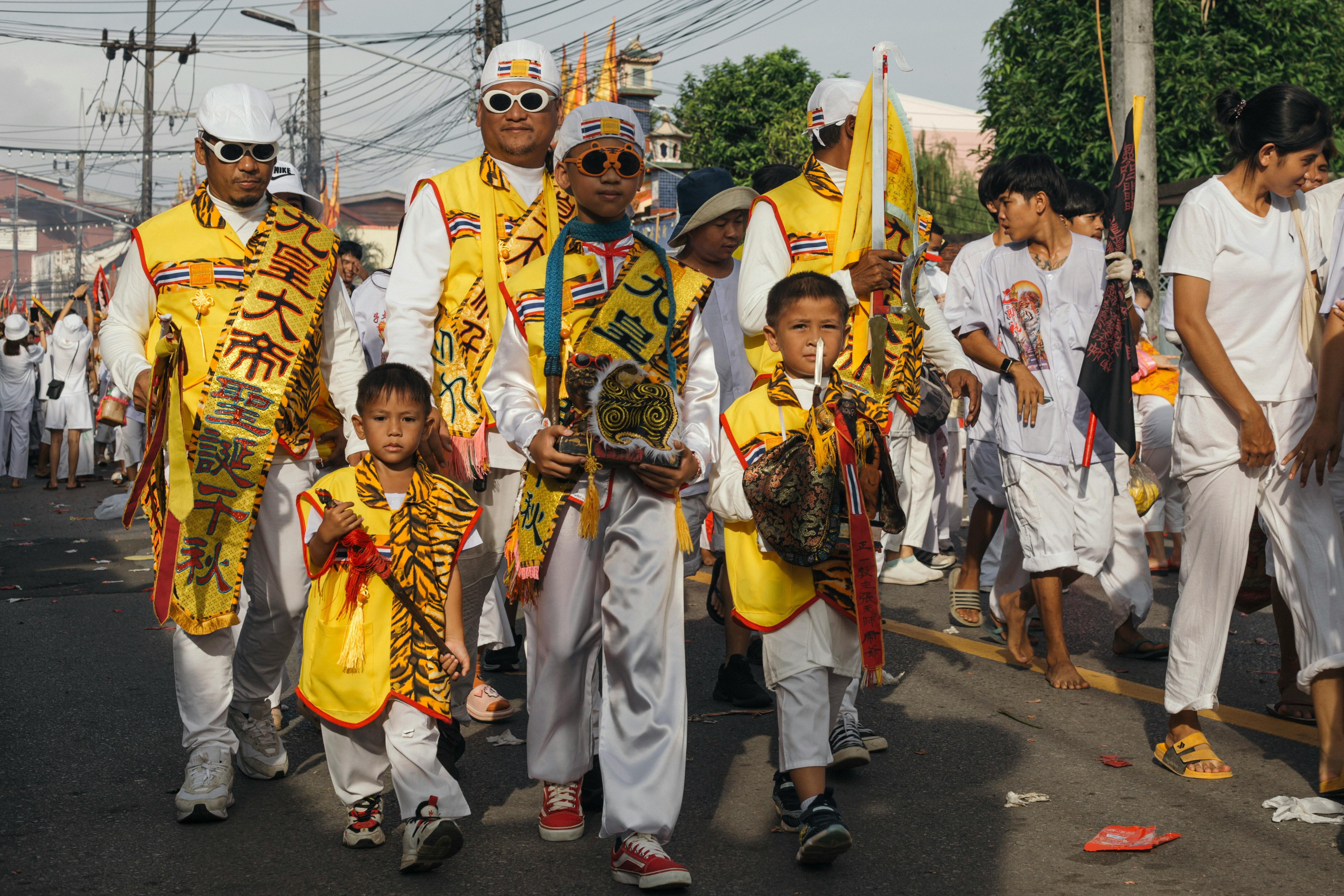 People in Costumes Walking in a Parade on the Street · Free Stock Photo