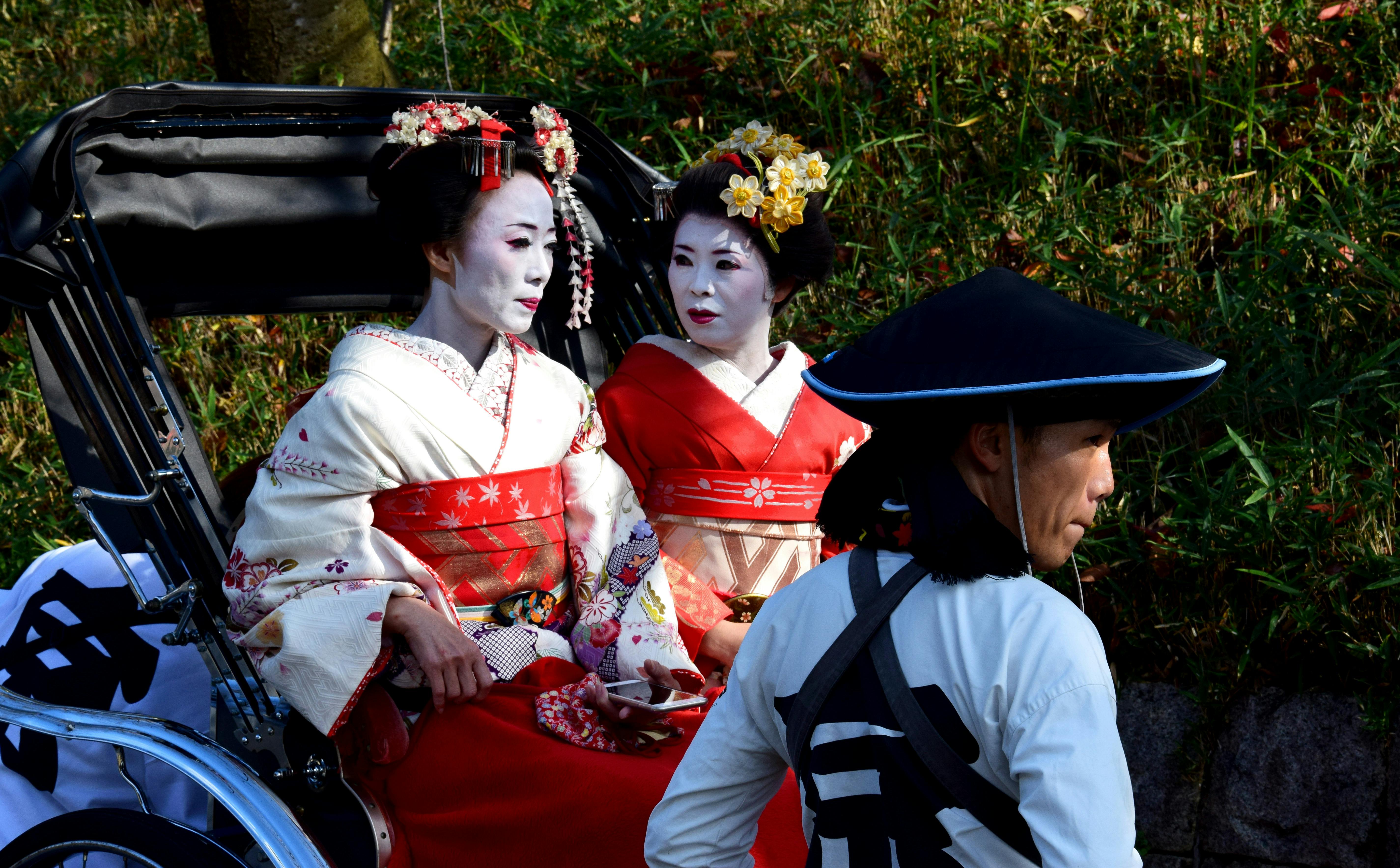 Geisha Sitting in a Carriage · Free Stock Photo