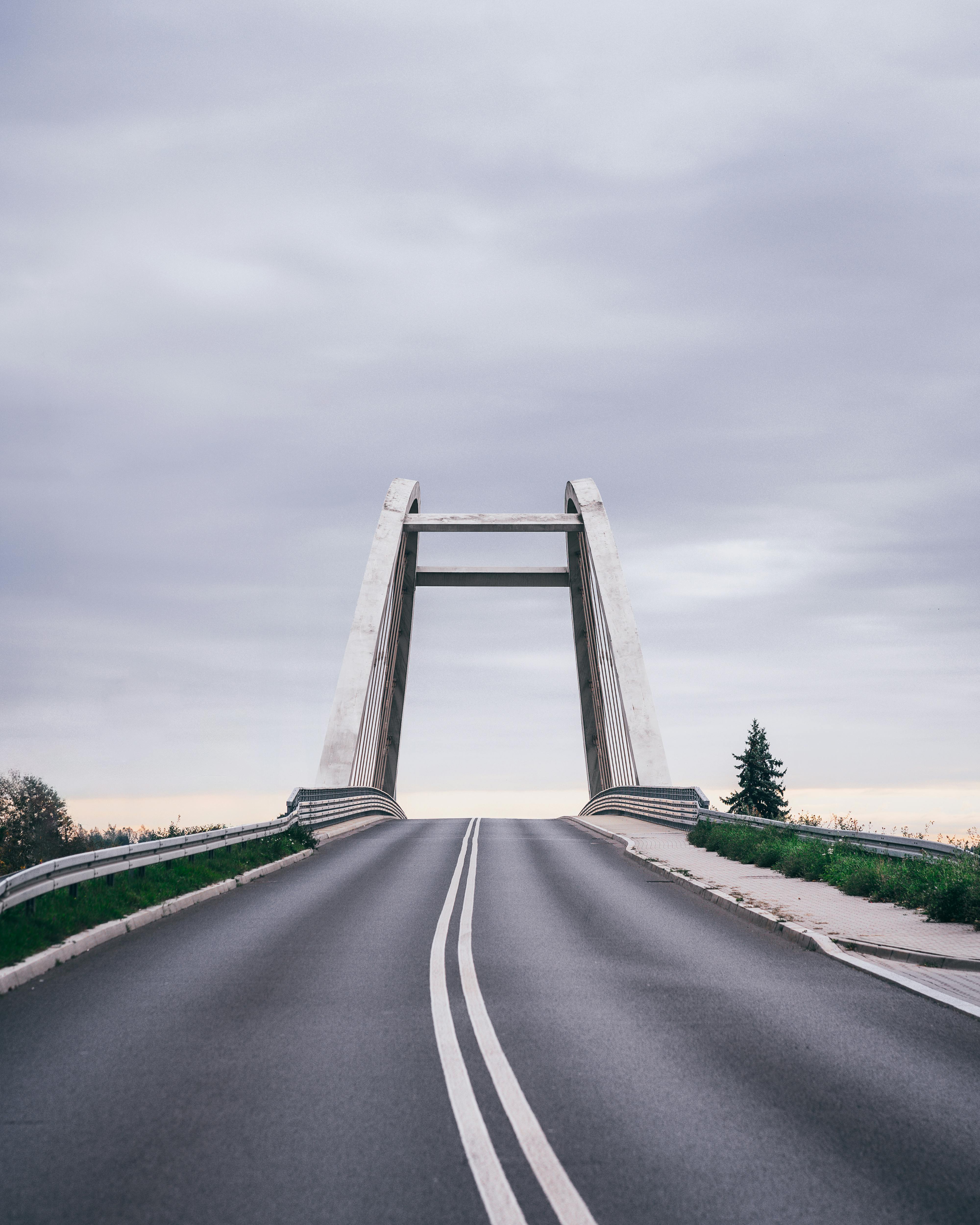 Road with Double Dividing Line and a Bridge · Free Stock Photo
