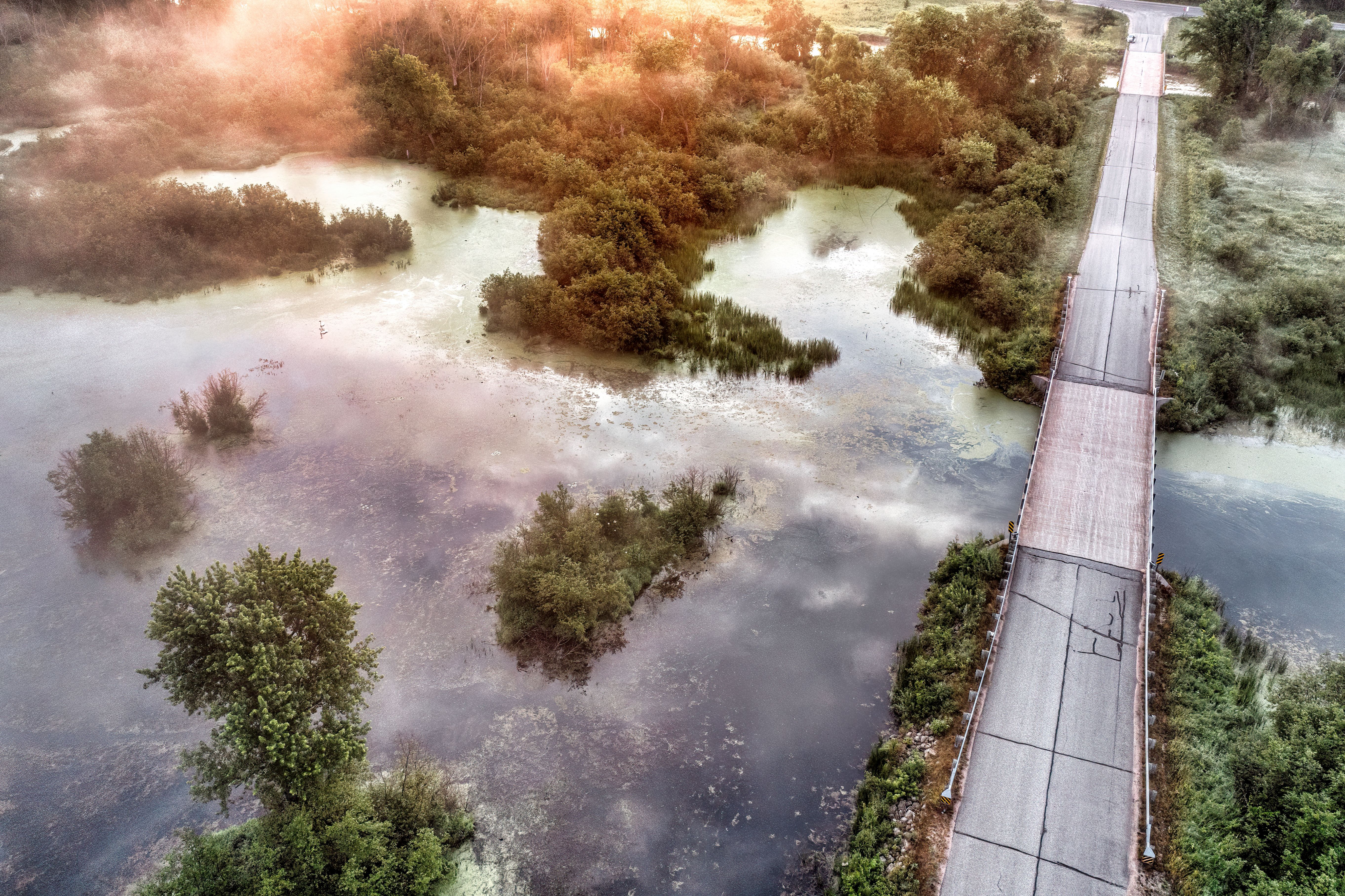 Aerial Photo with a Bridge Crossing Wetlands at Dawn · Free Stock Photo