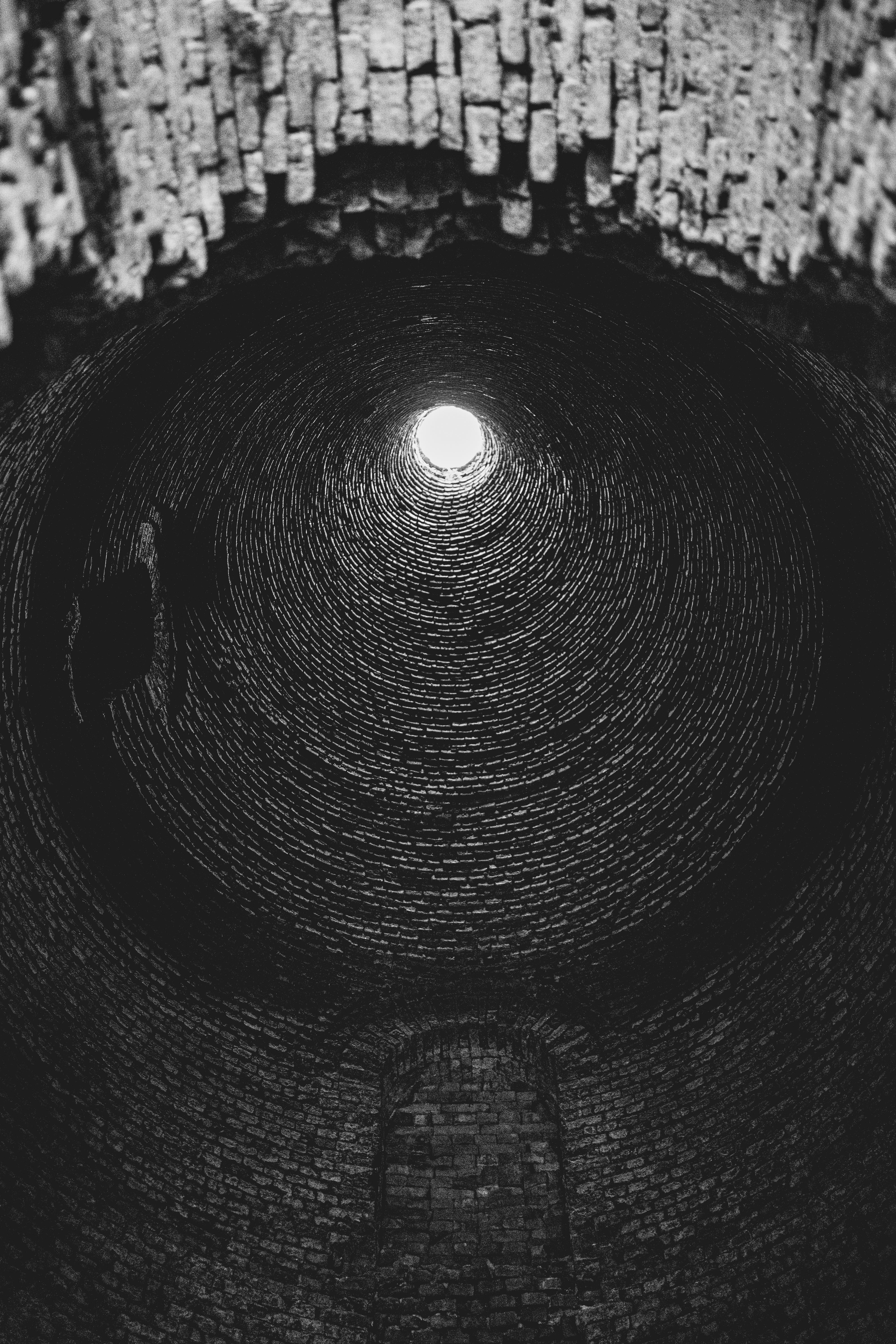 Black and White Photo of a Brick Chimney Interior · Free Stock Photo