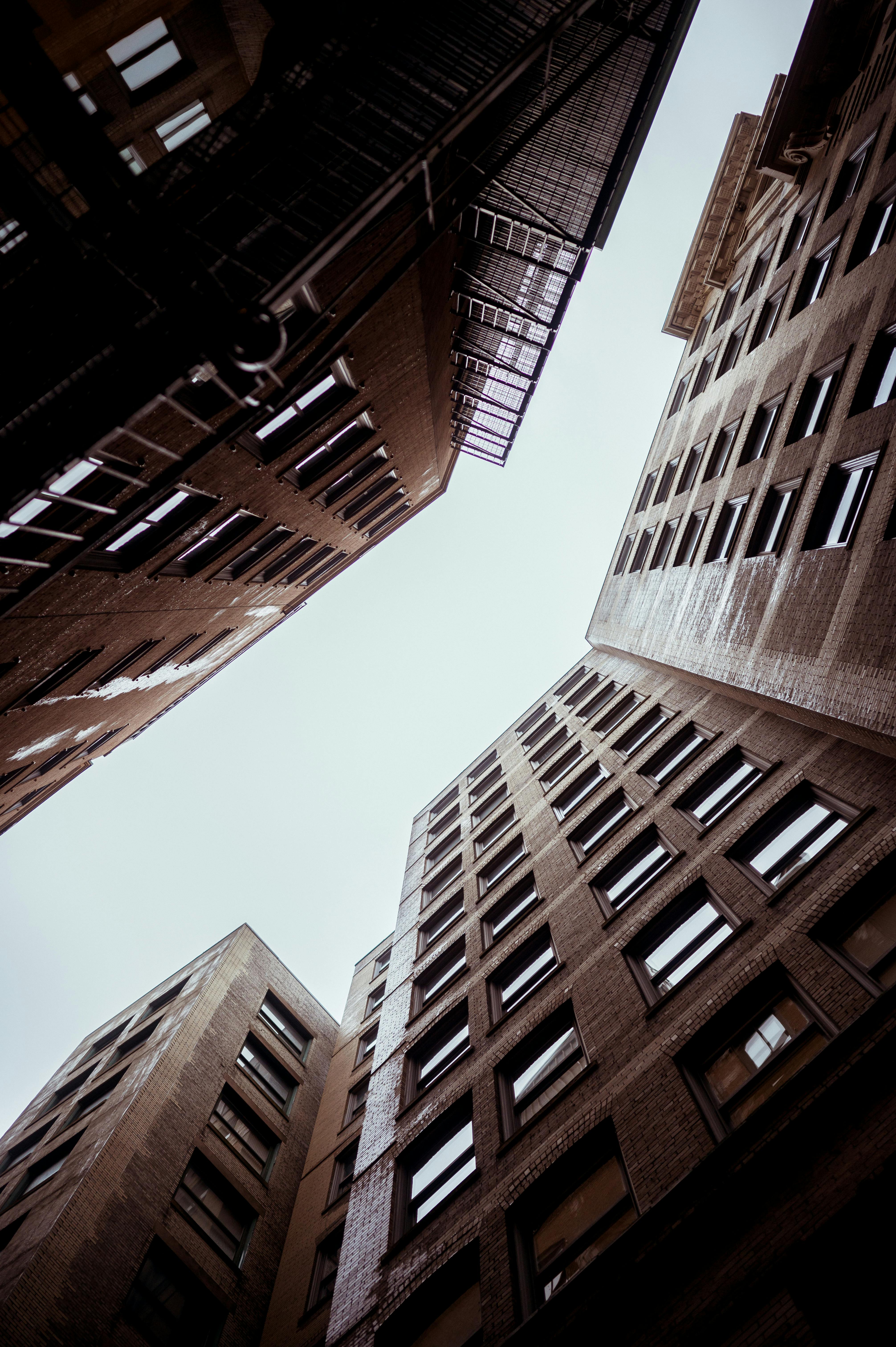 A view of tall buildings from below · Free Stock Photo