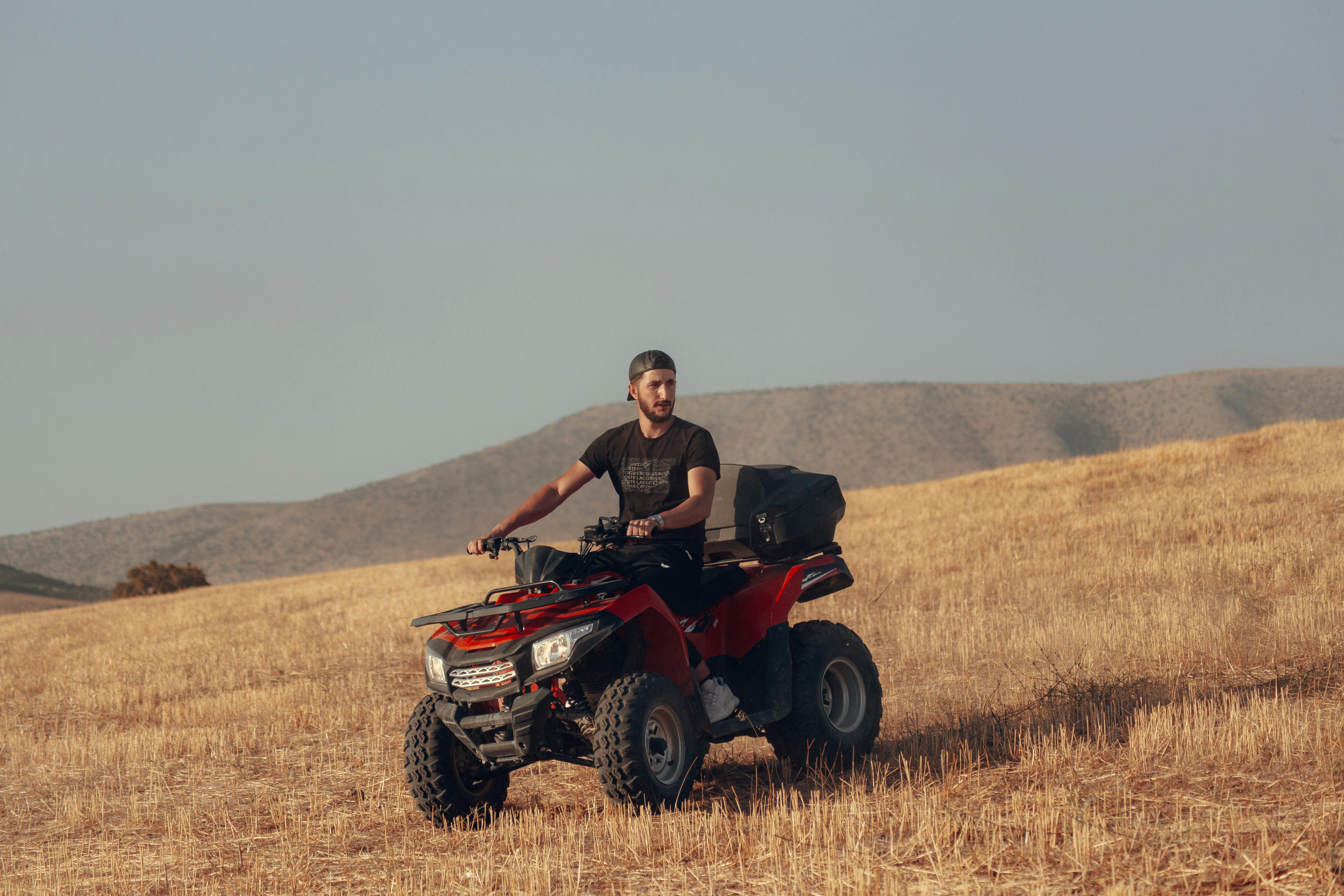 Man Riding Quadbike · Free Stock Photo