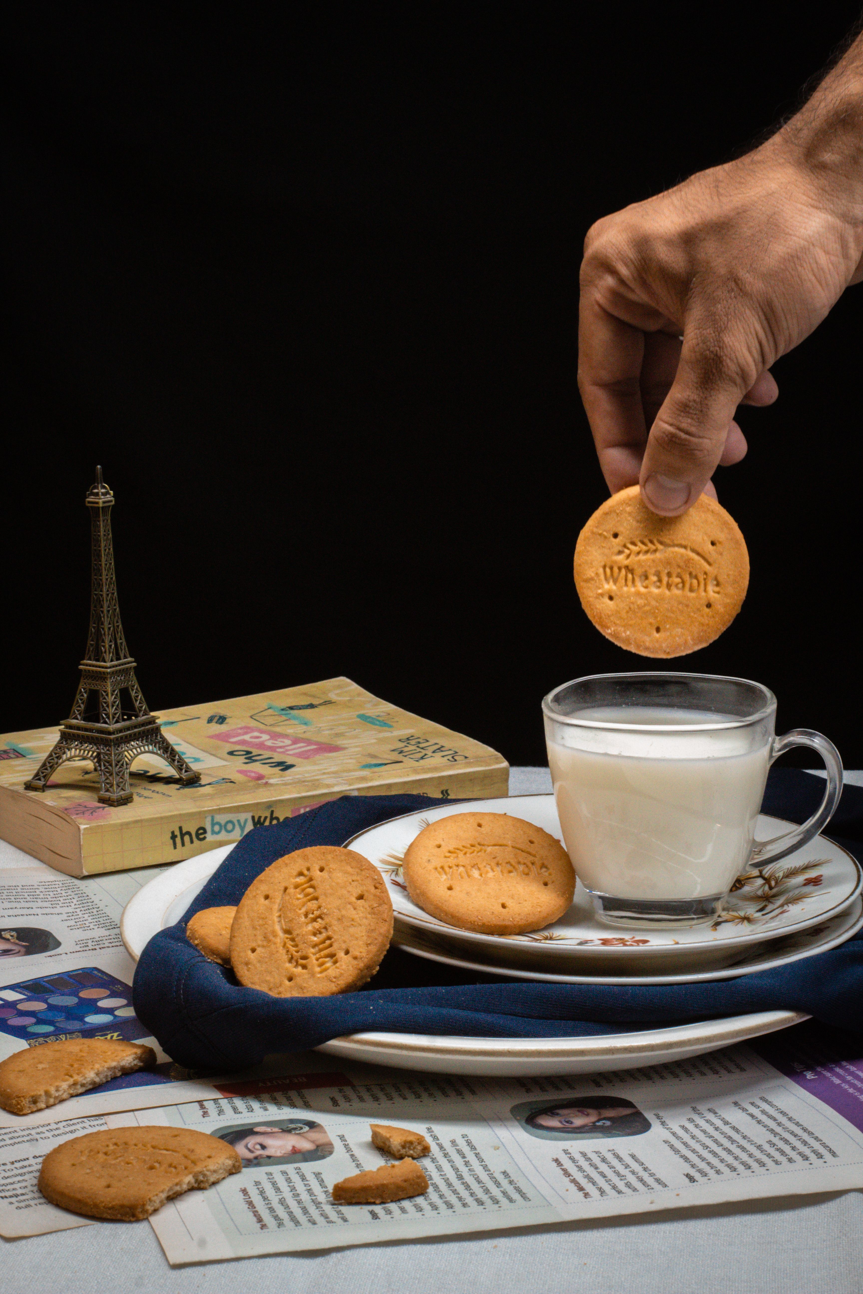 Close-up of a Person Dipping a Biscuit in Milk · Free Stock Photo