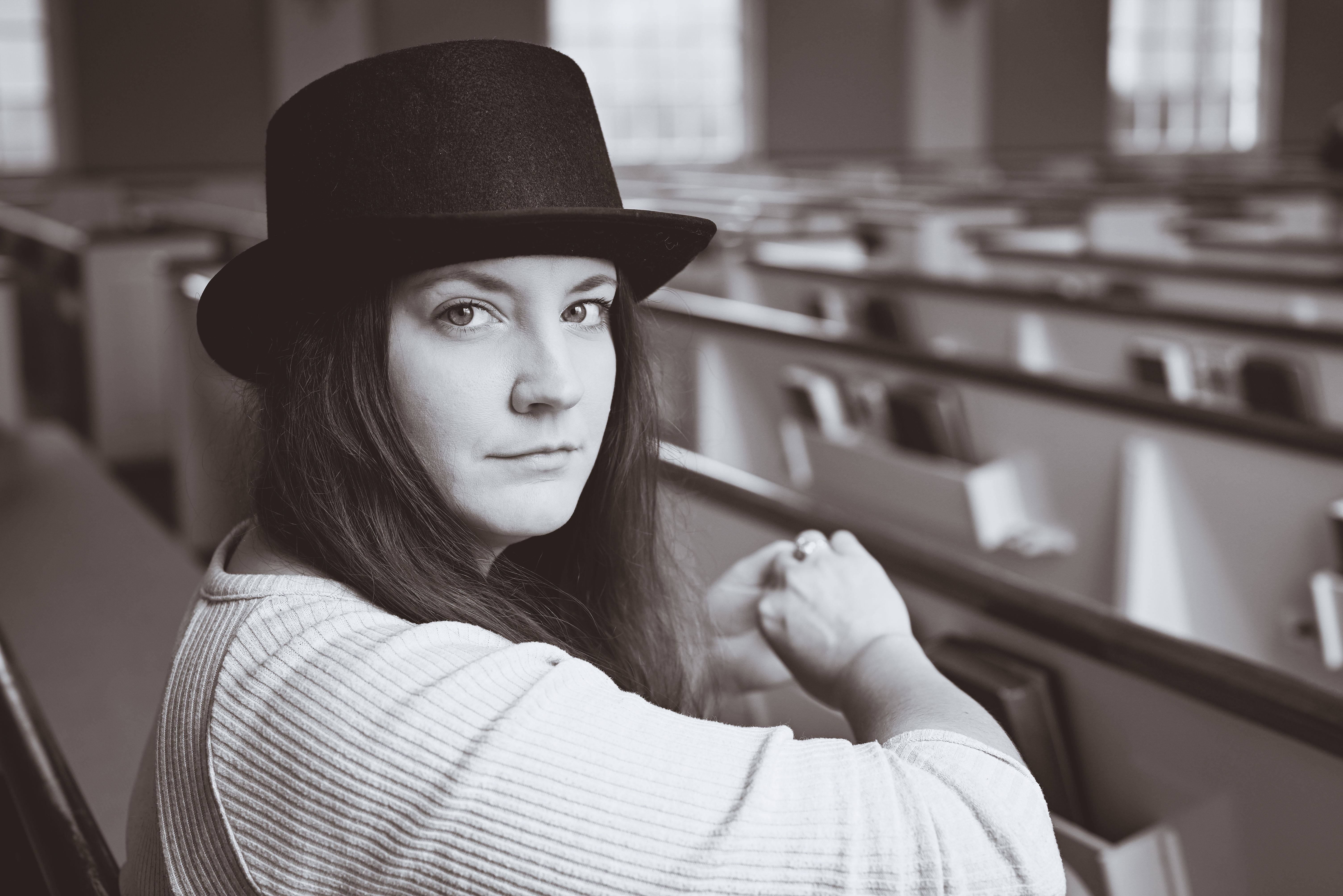 Portrait of Woman in a Lecture Room in Black and White · Free Stock Photo