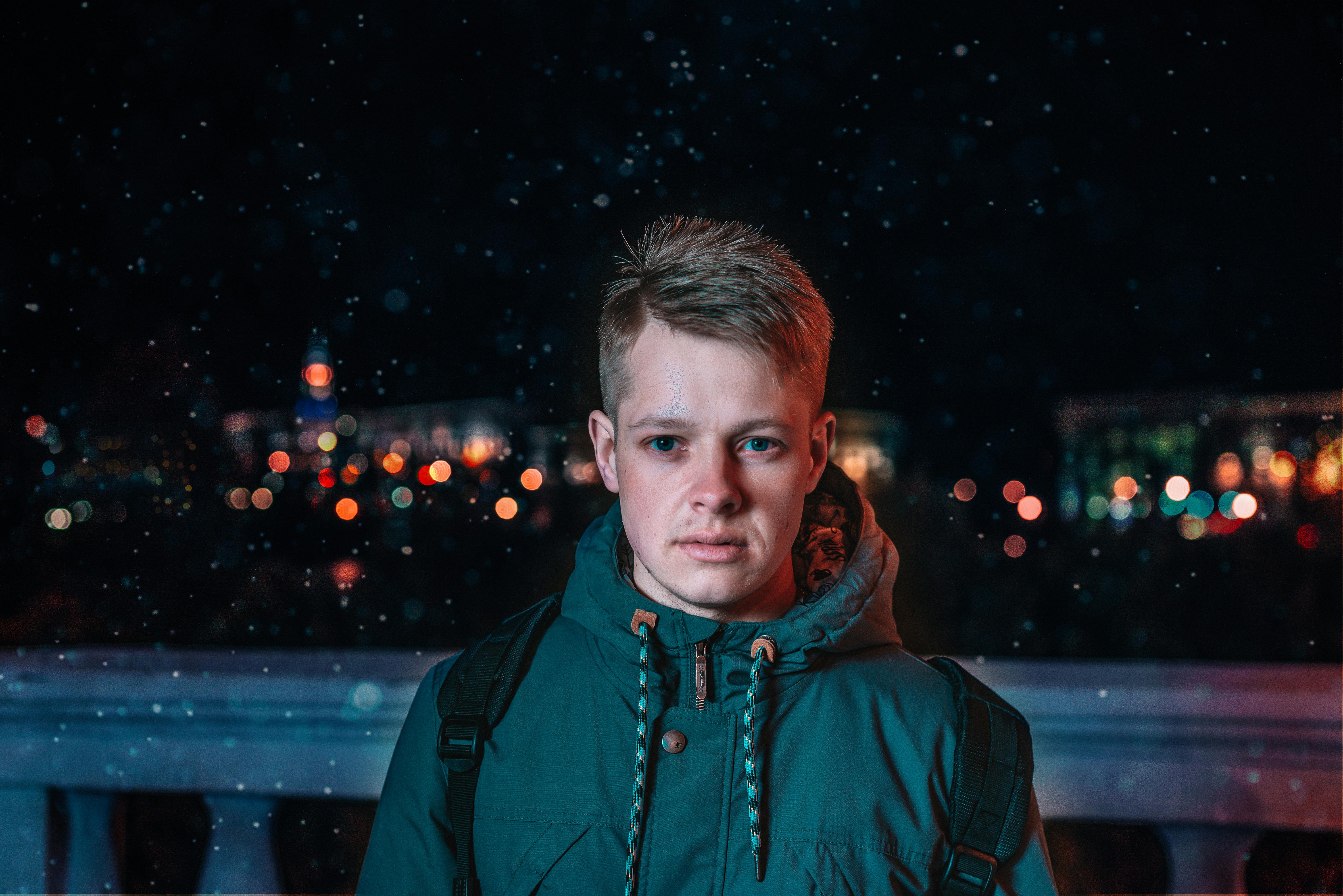 Portrait of Blonde Man on a Bridge at Night · Free Stock Photo