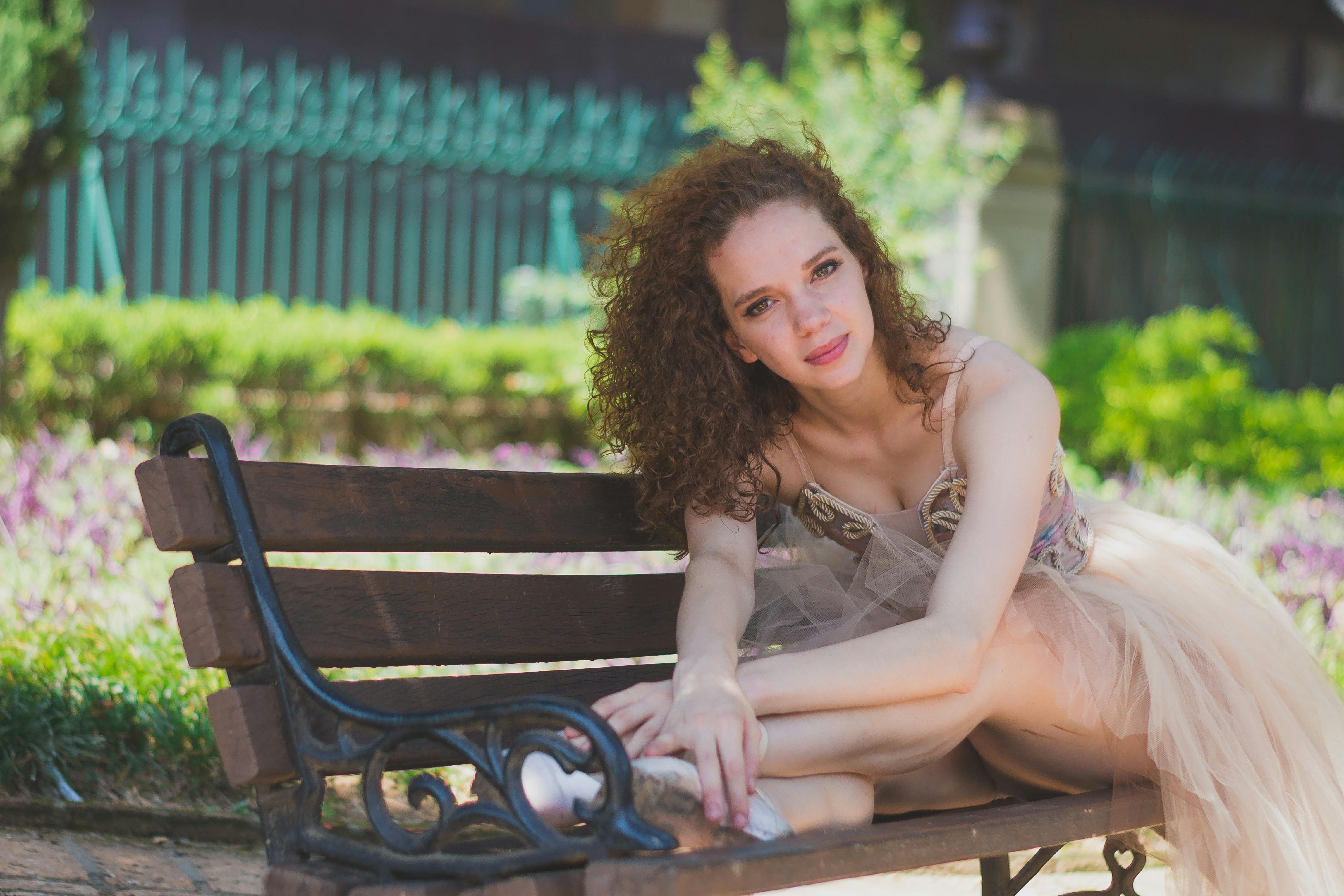 Woman Sitting on Bench · Free Stock Photo