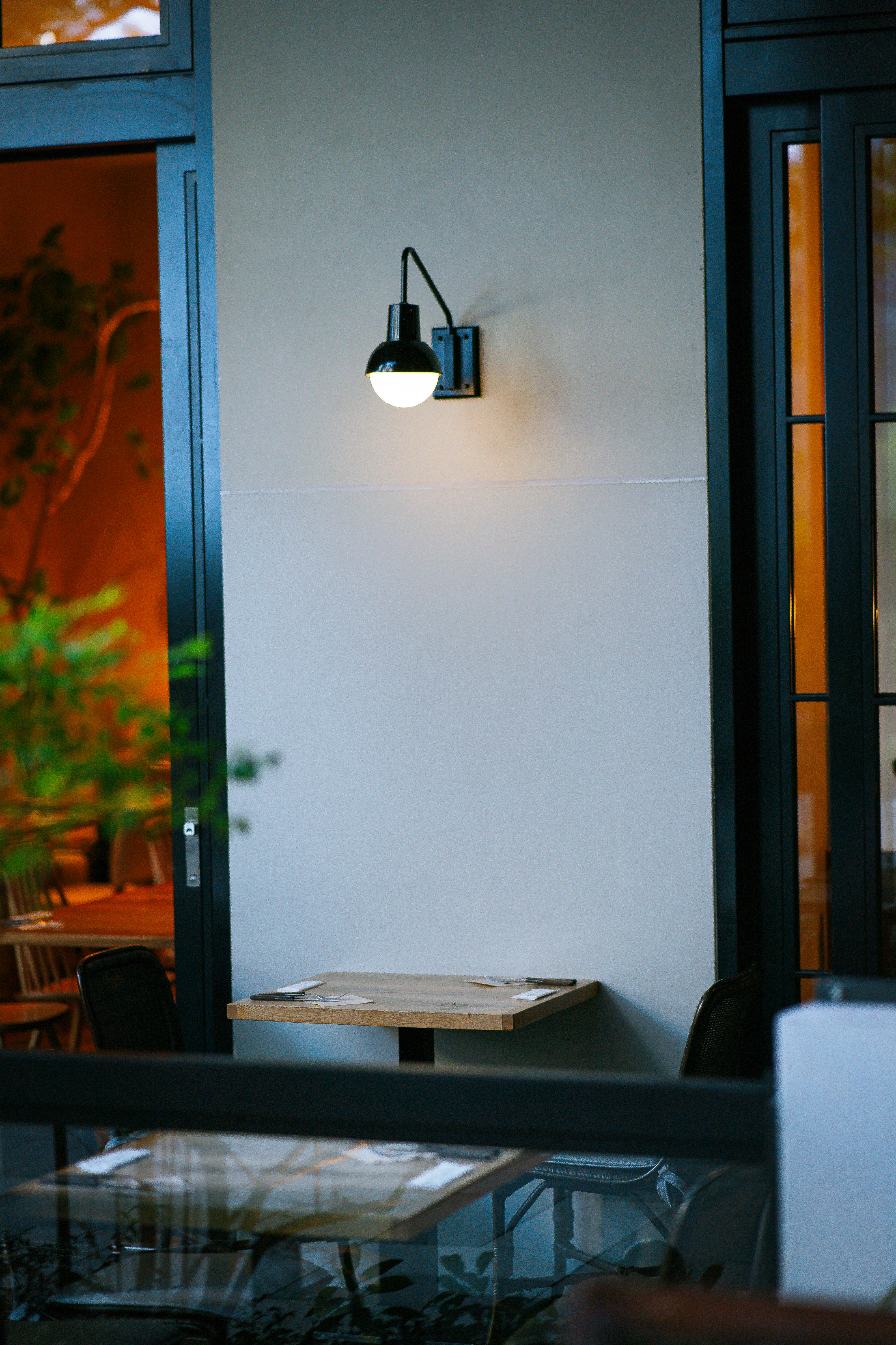 Lamp on Wall above Table · Free Stock Photo