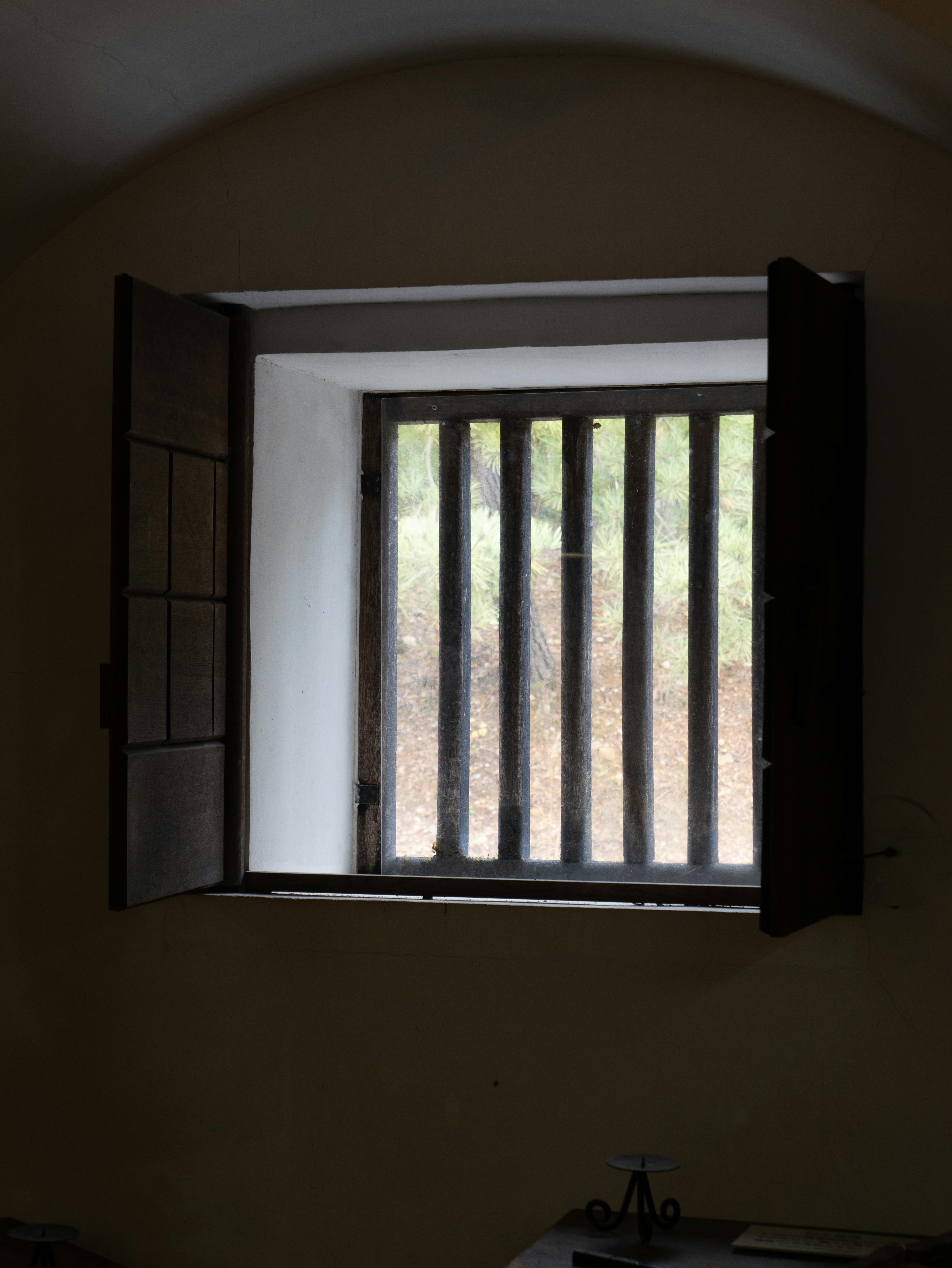 Bars In An Opened Window · Free Stock Photo