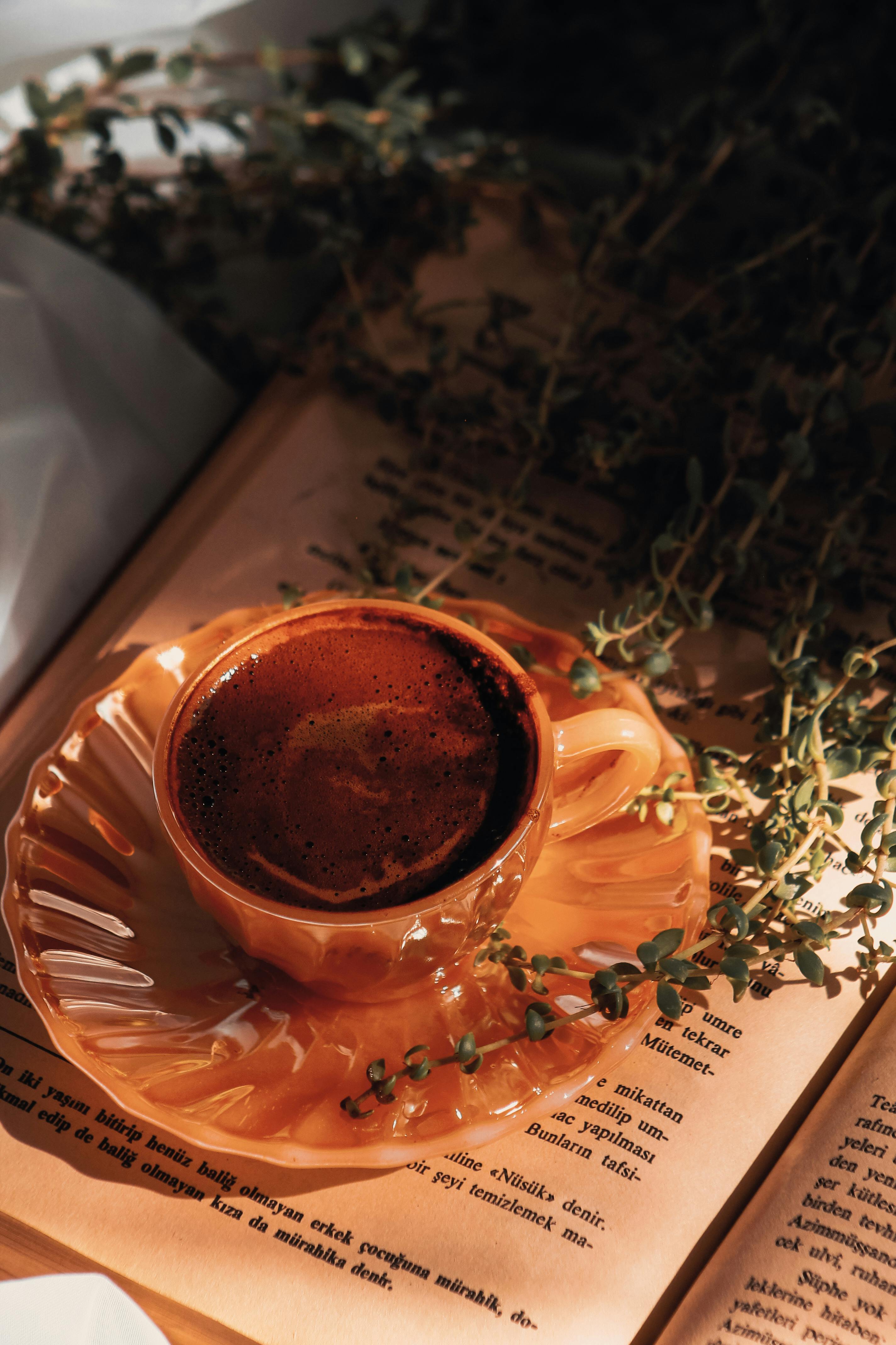 Still Life with a Cup of Hot Chocolate on a Vintage Book · Free Stock Photo