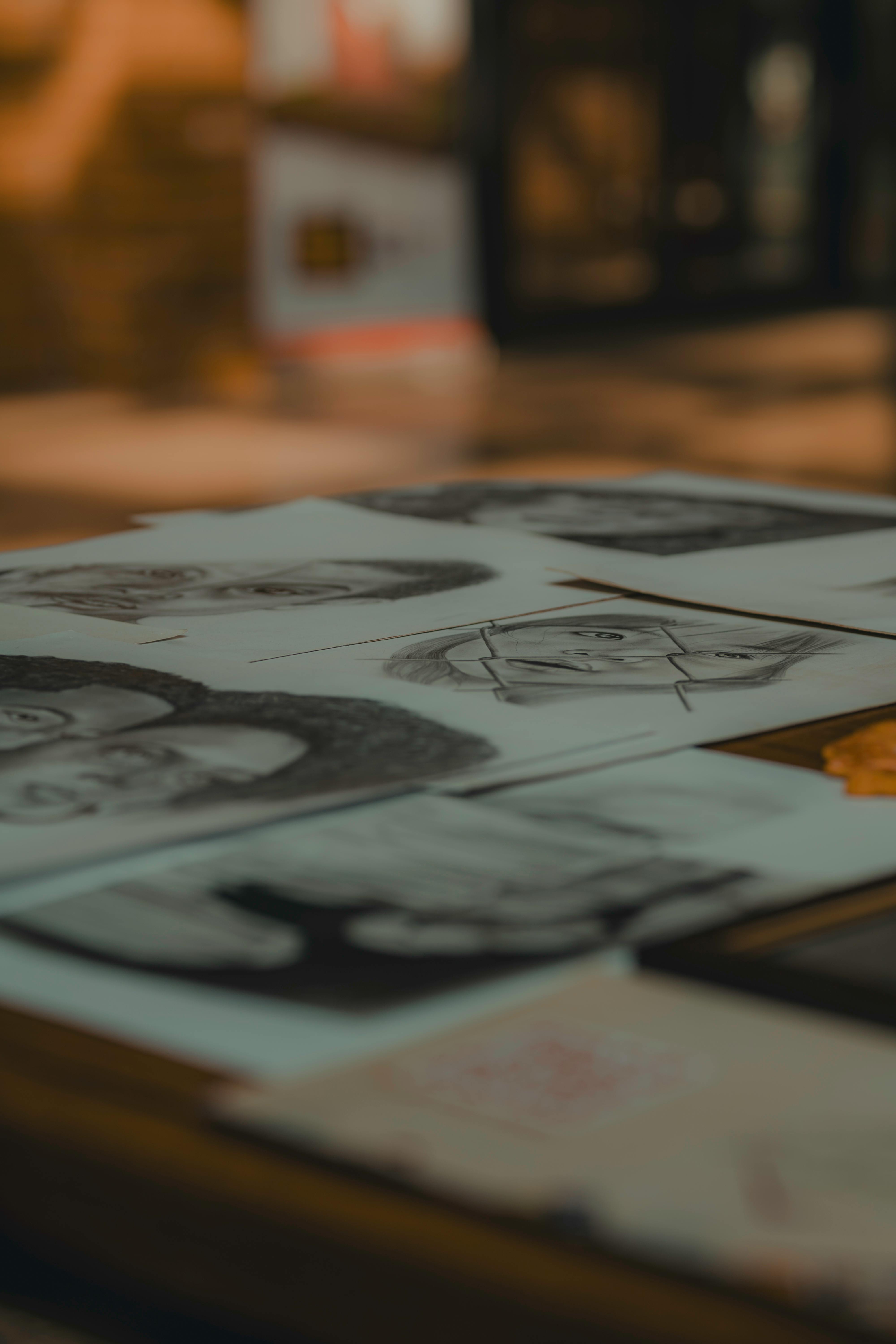 Pencil Drawings Spread Out on the Table · Free Stock Photo