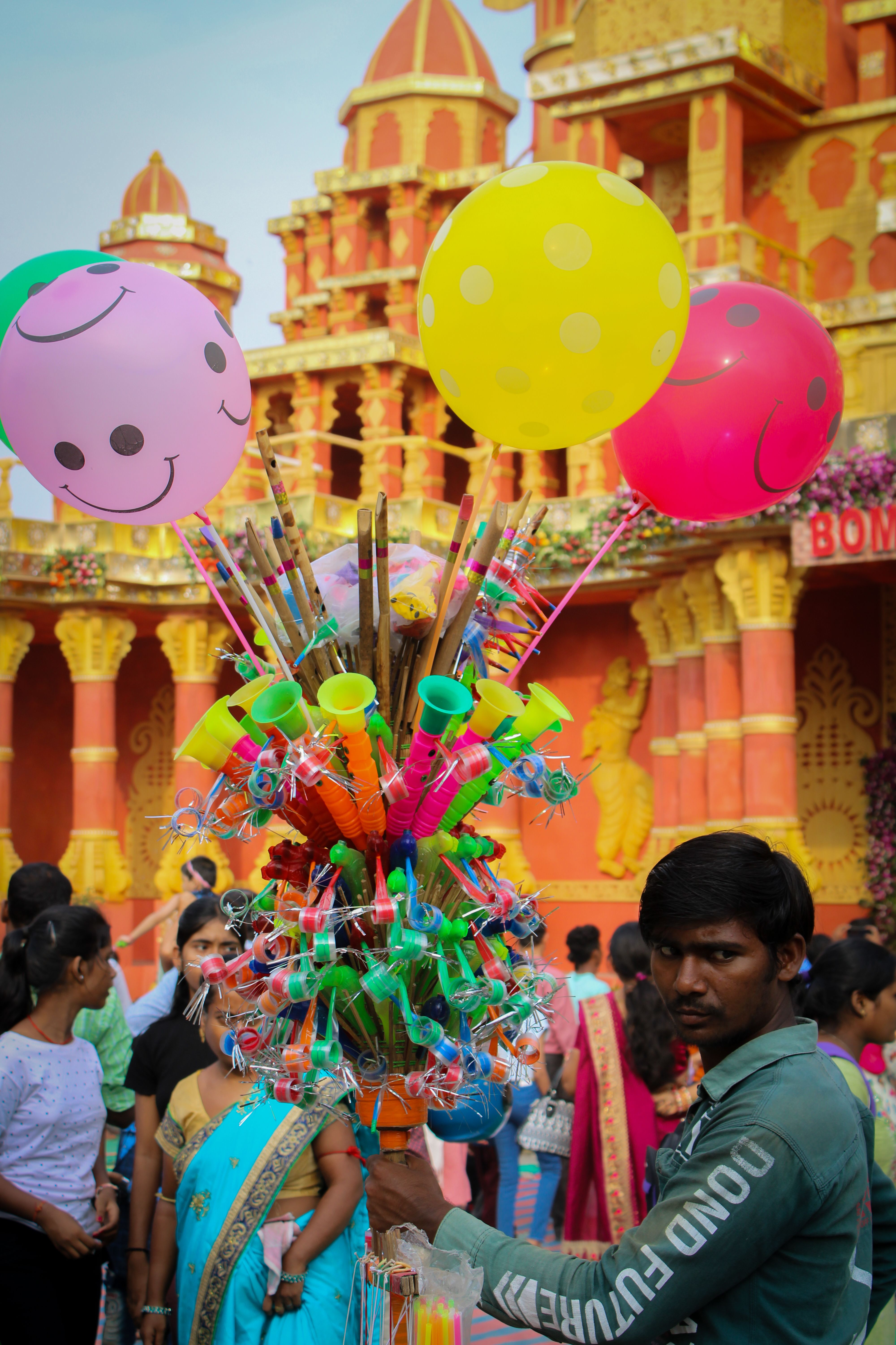 Man Selling Balloons at the Street Festival in India · Free Stock Photo