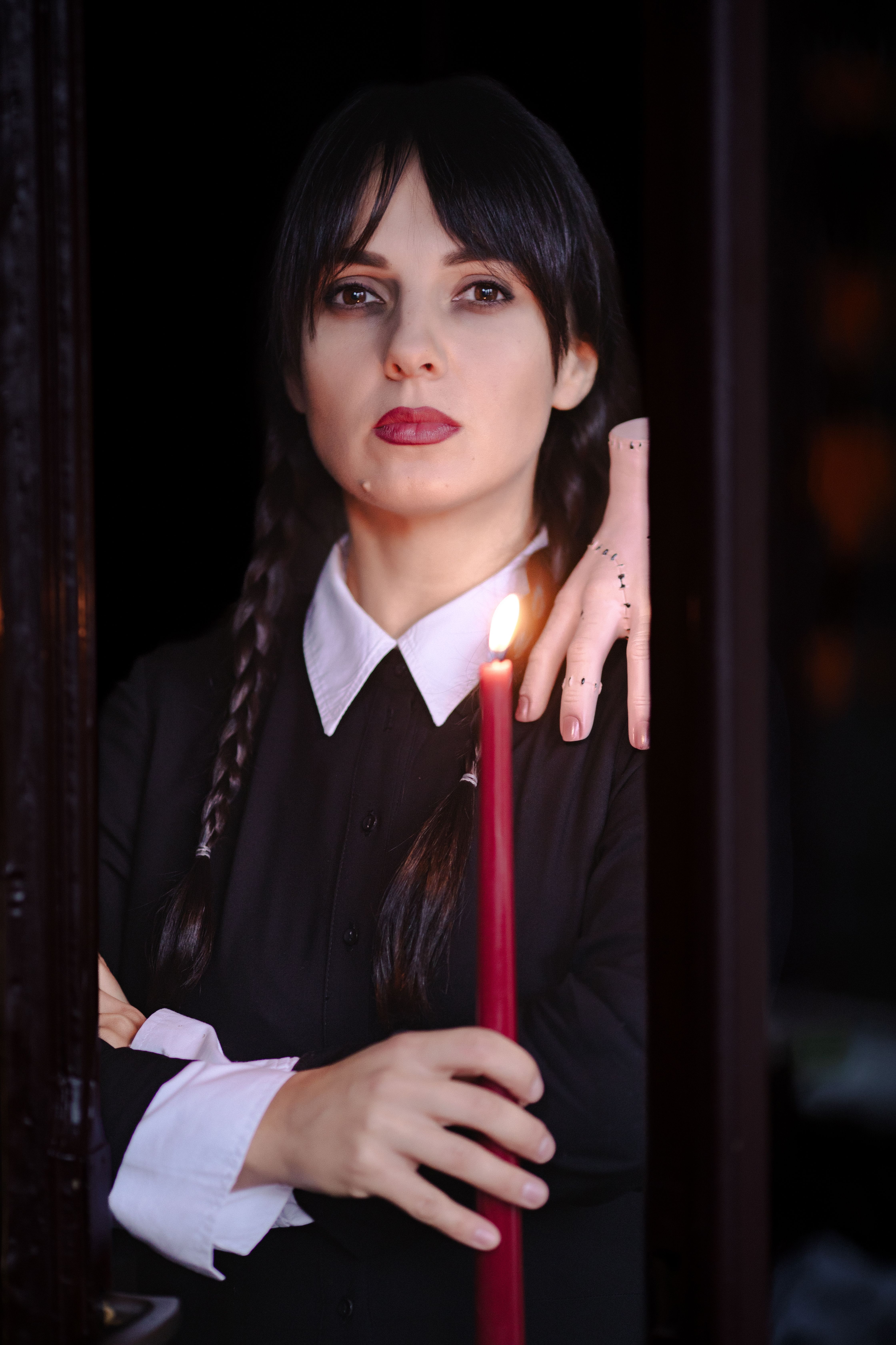 Woman Wearing Wednesday Addams Costume and Holding a Candle · Free ...