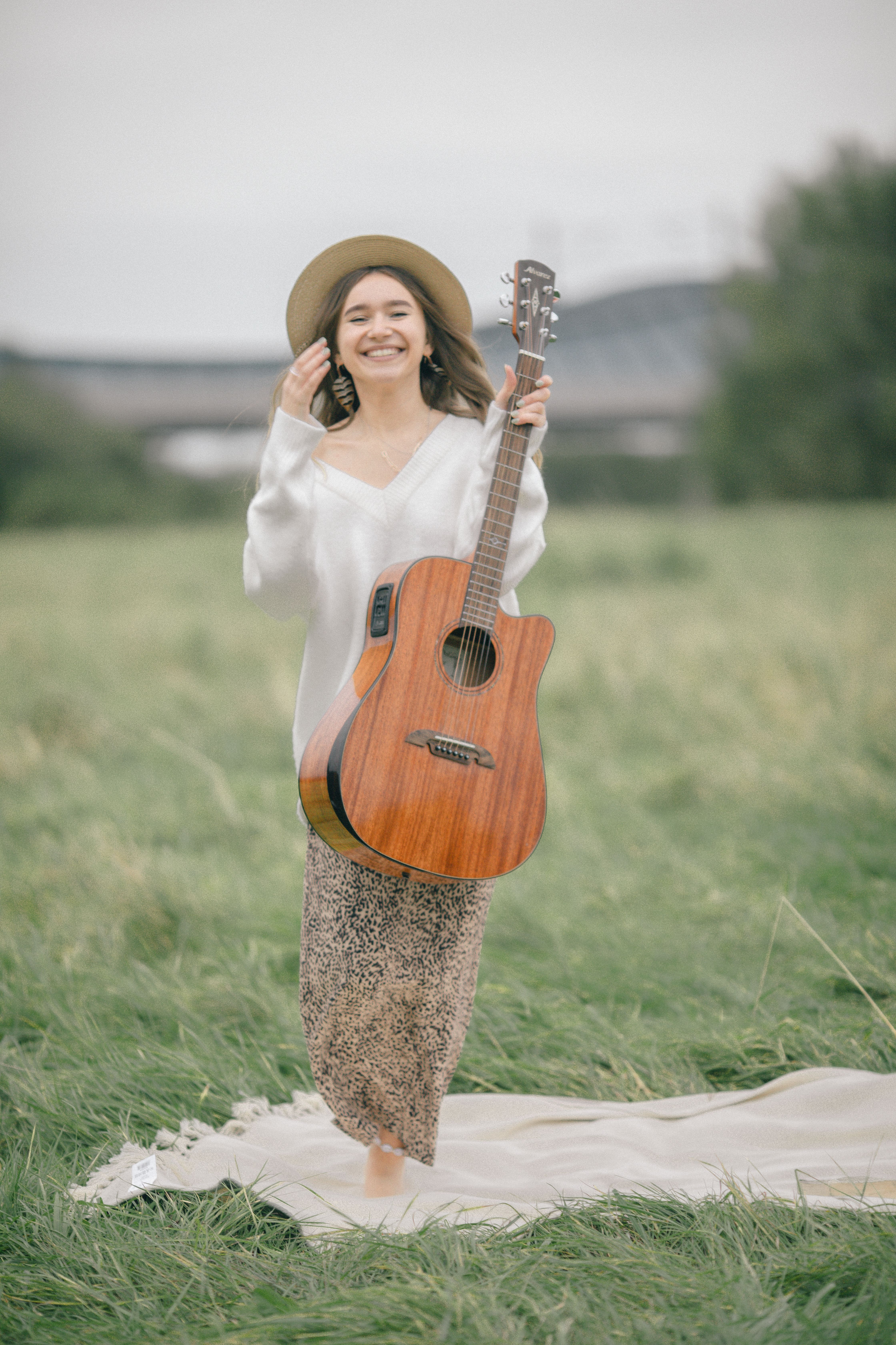 Laughing Young Woman with Guitar · Free Stock Photo