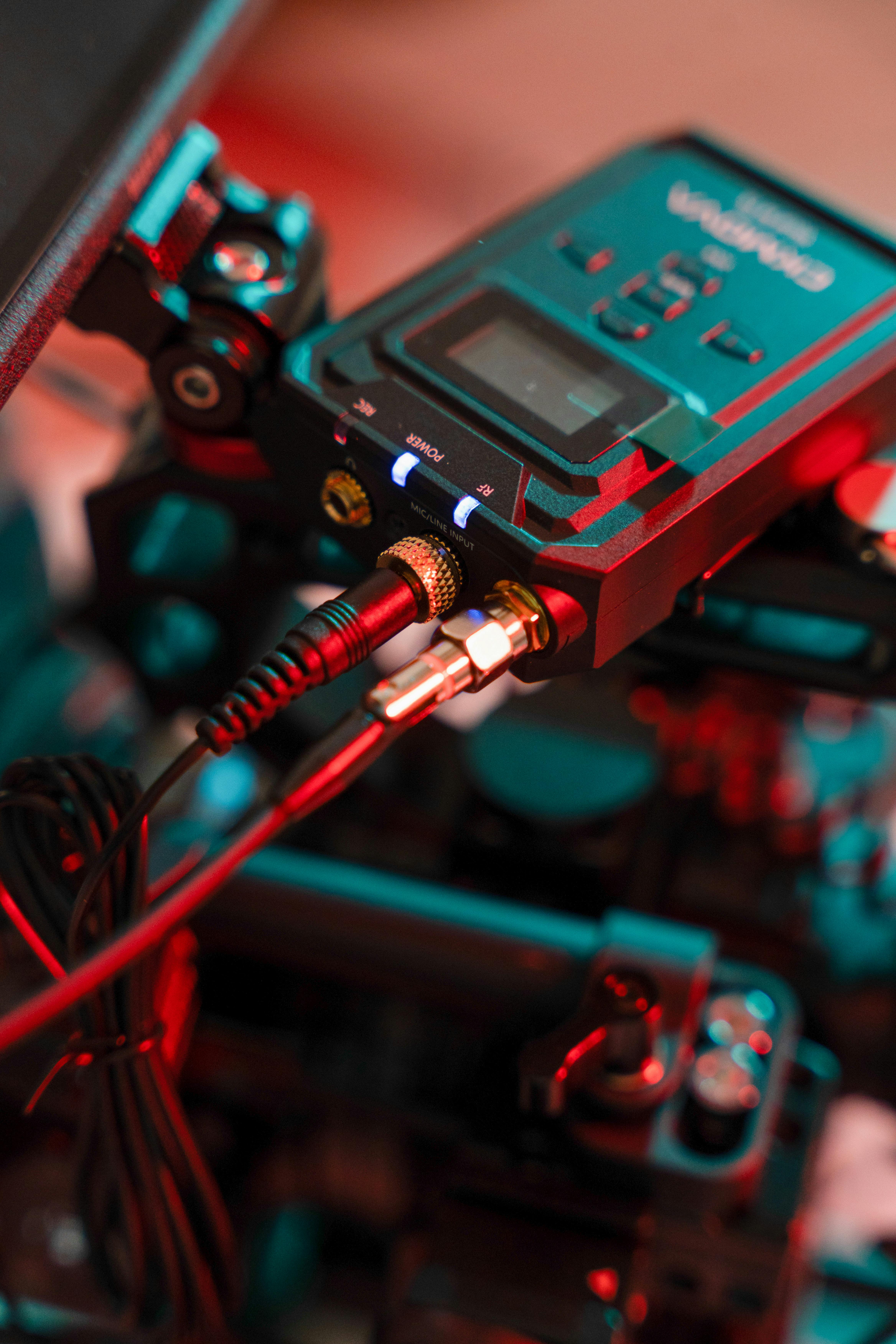Close-up of a Bunch of Cables Plugged into a Device · Free Stock Photo