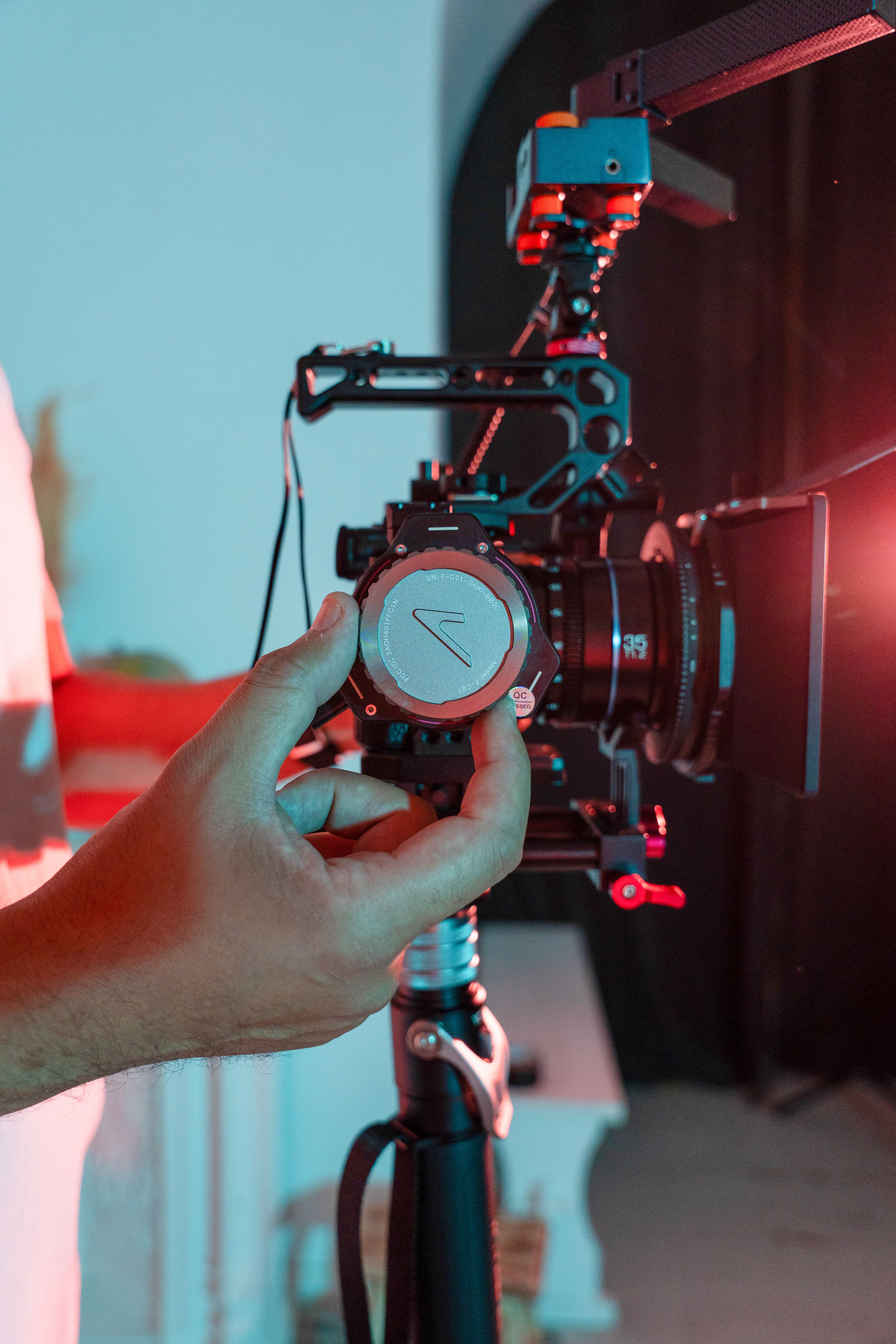 Close-up of a Men Adjusting the Camera in Studio · Free Stock Photo