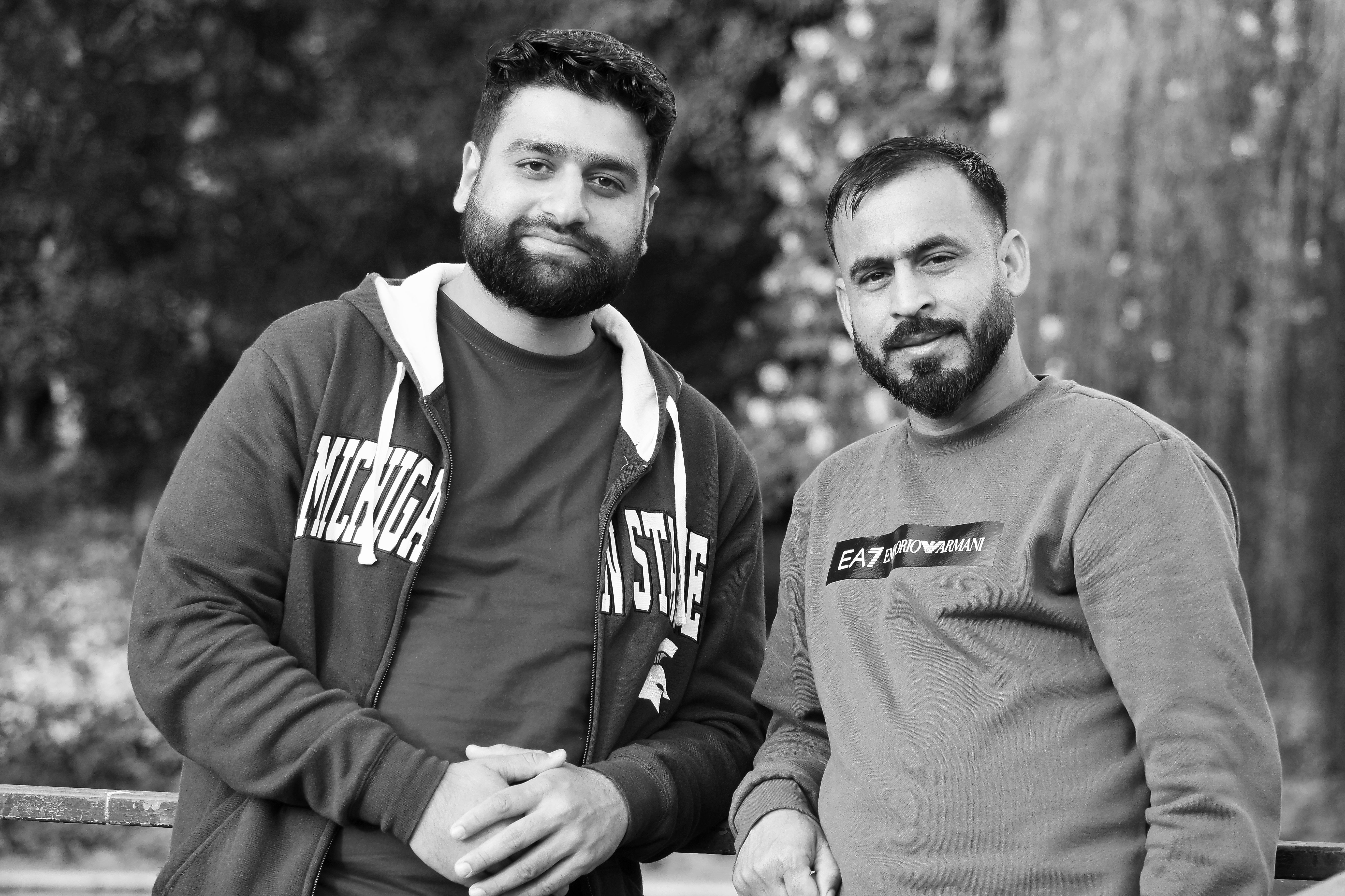 Portrait of Two Bearded Men Standing Together Outdoors · Free Stock Photo