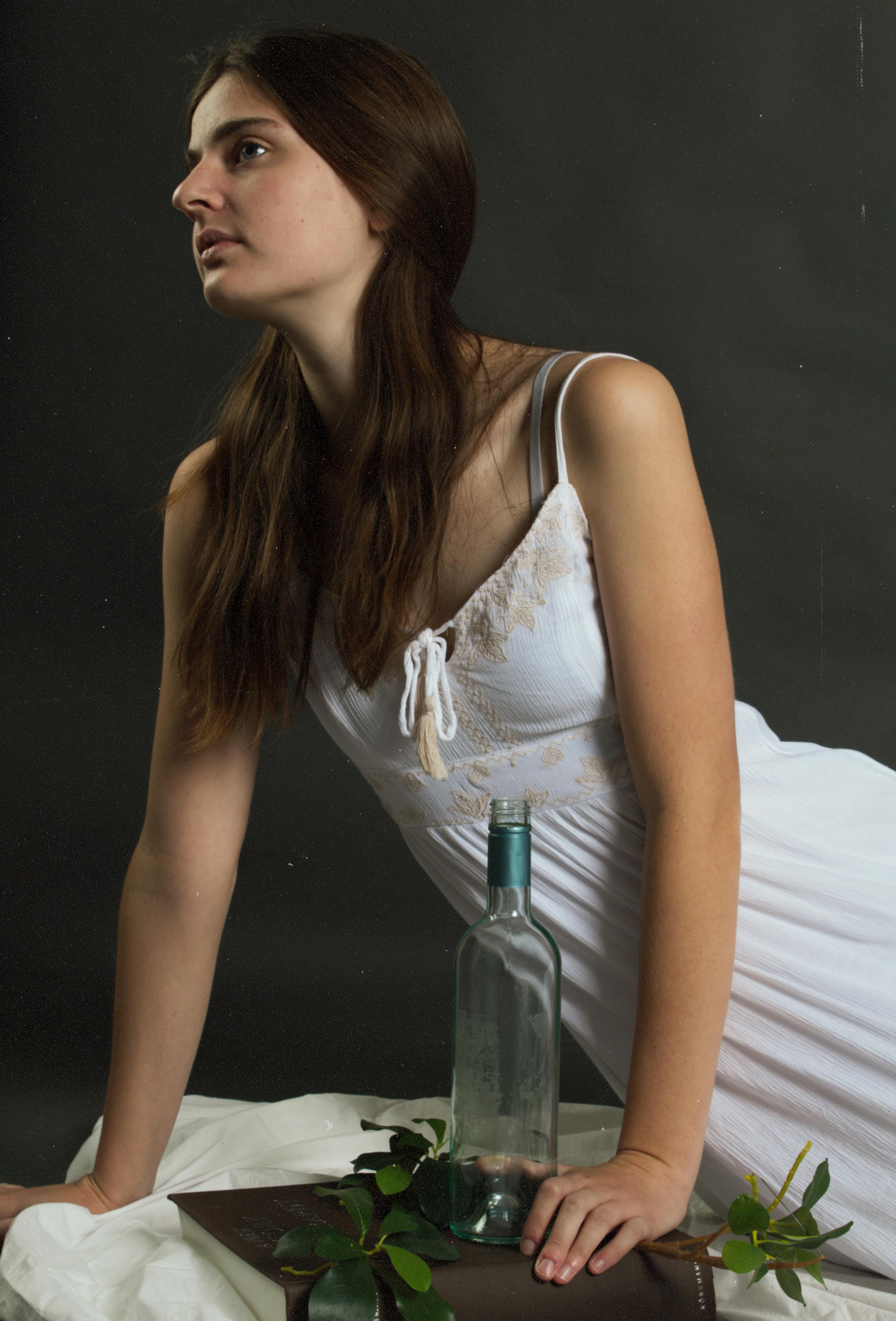 Bending Woman in White Dress · Free Stock Photo