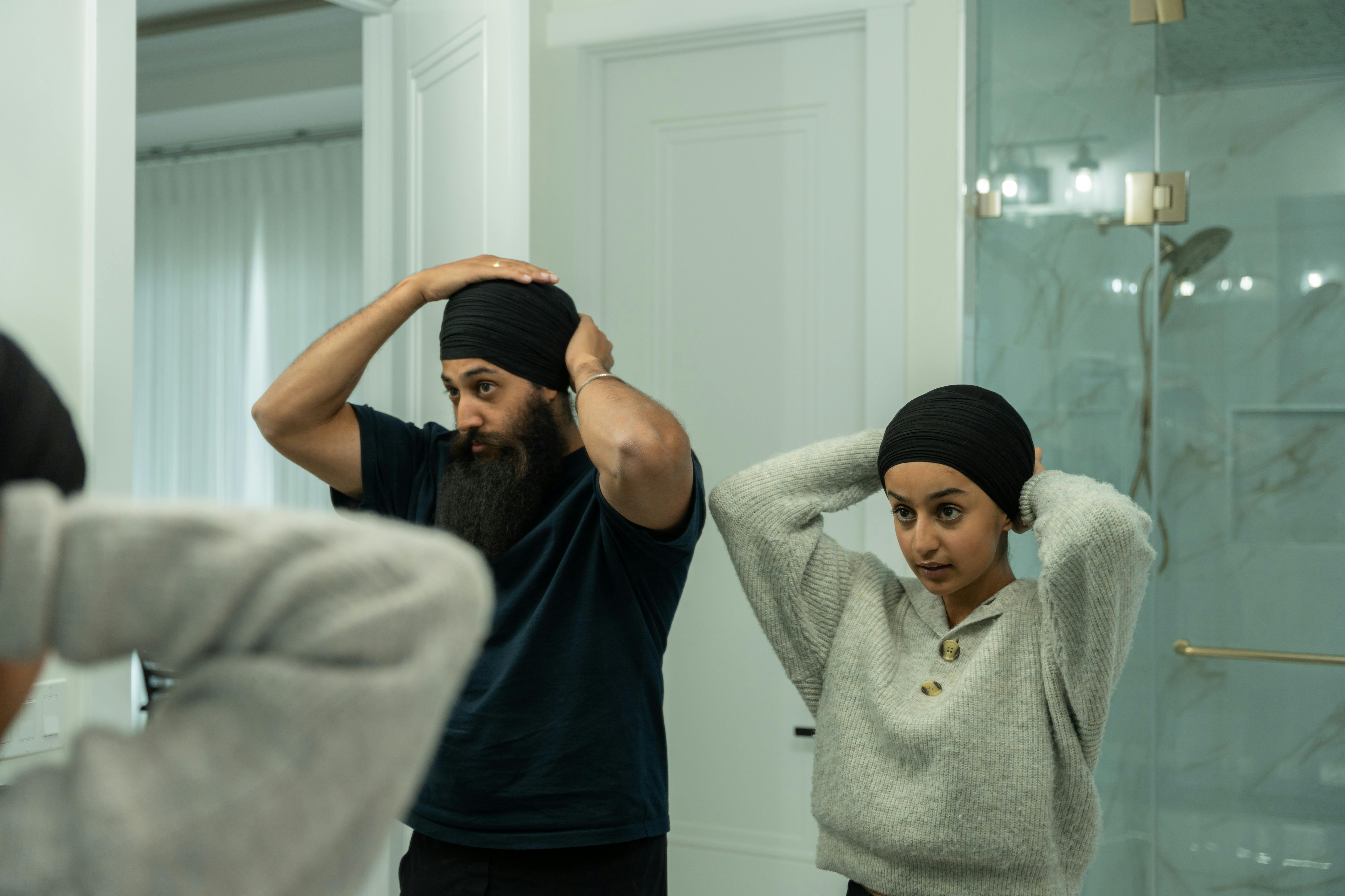 Mirror Reflection of Man and Woman in Turbans · Free Stock Photo