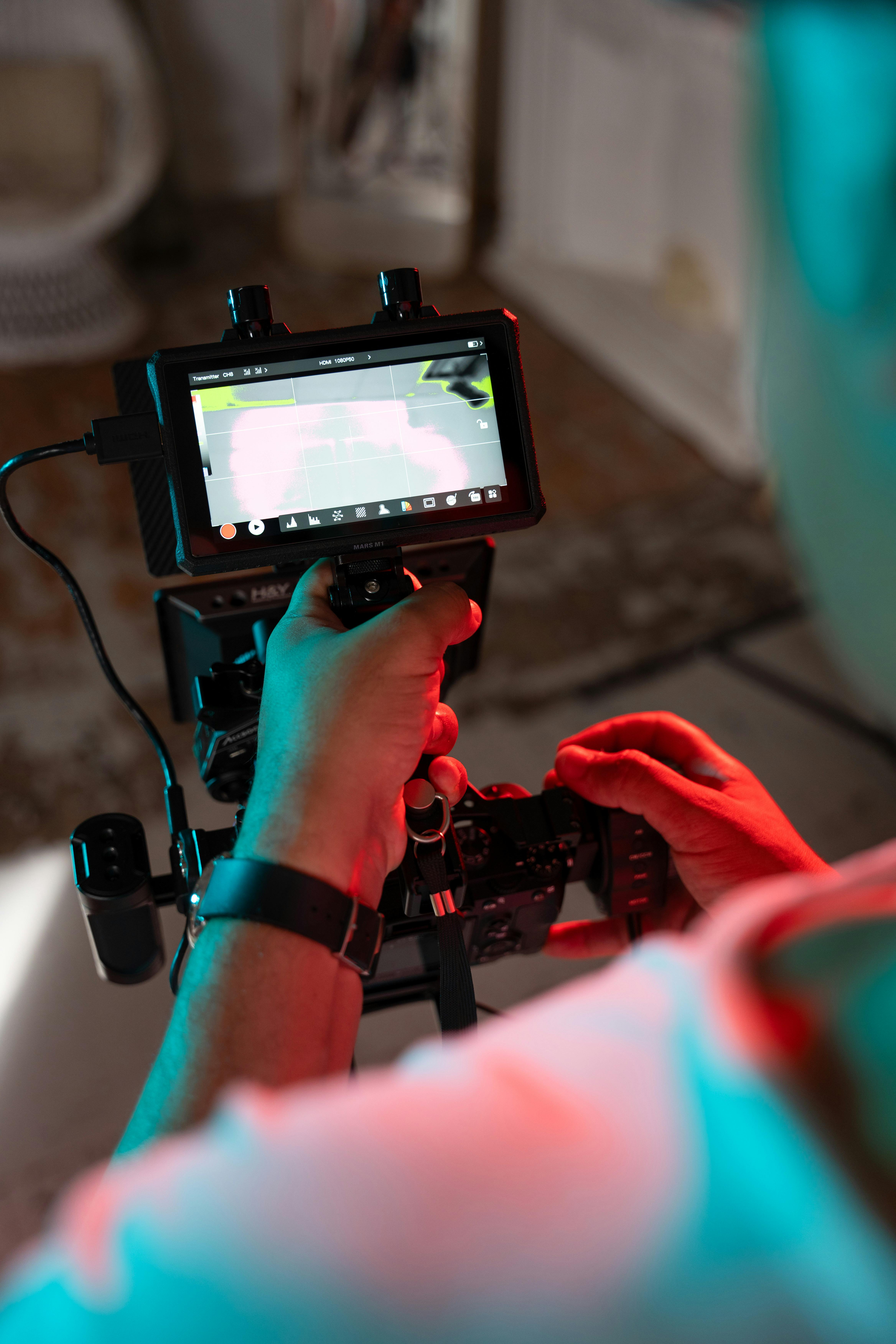 Man Using Camera with Stabilizer · Free Stock Photo