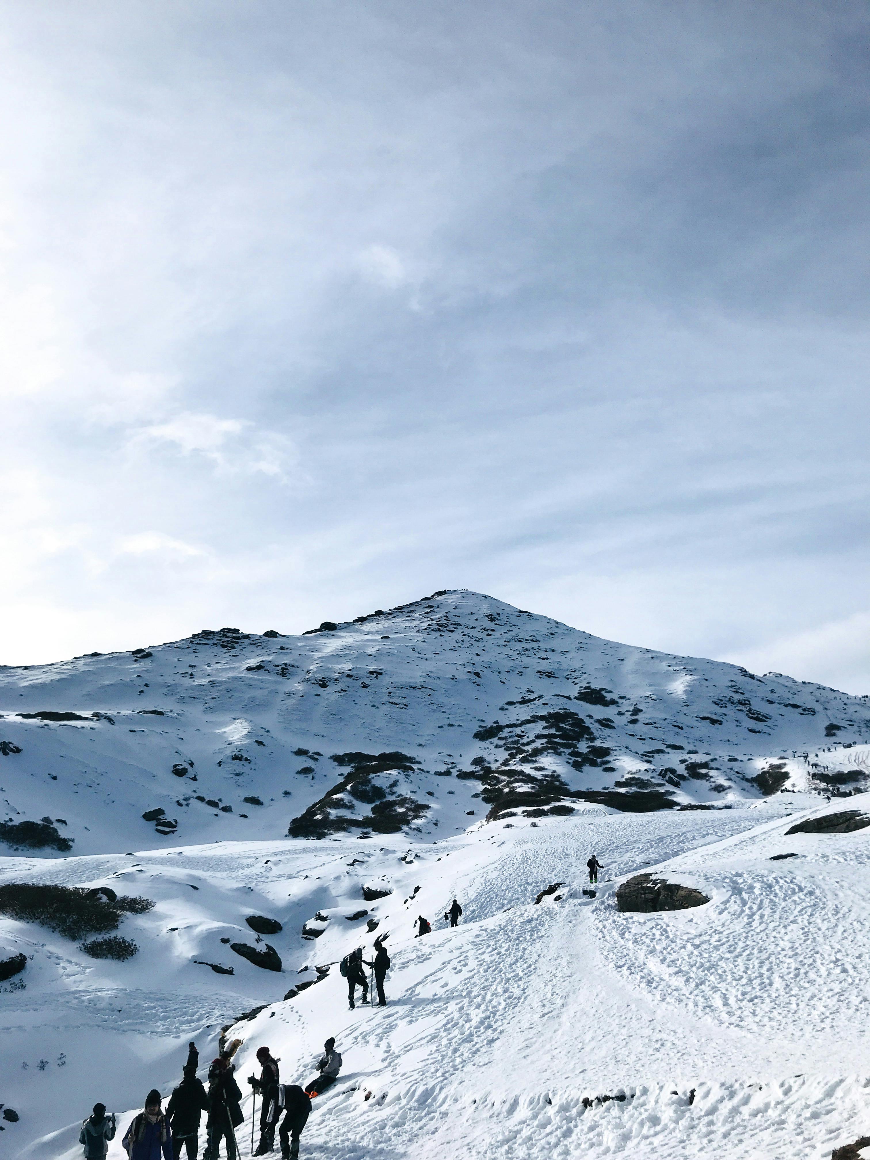 People Walking on Snow Field Grayscale Photography · Free Stock Photo
