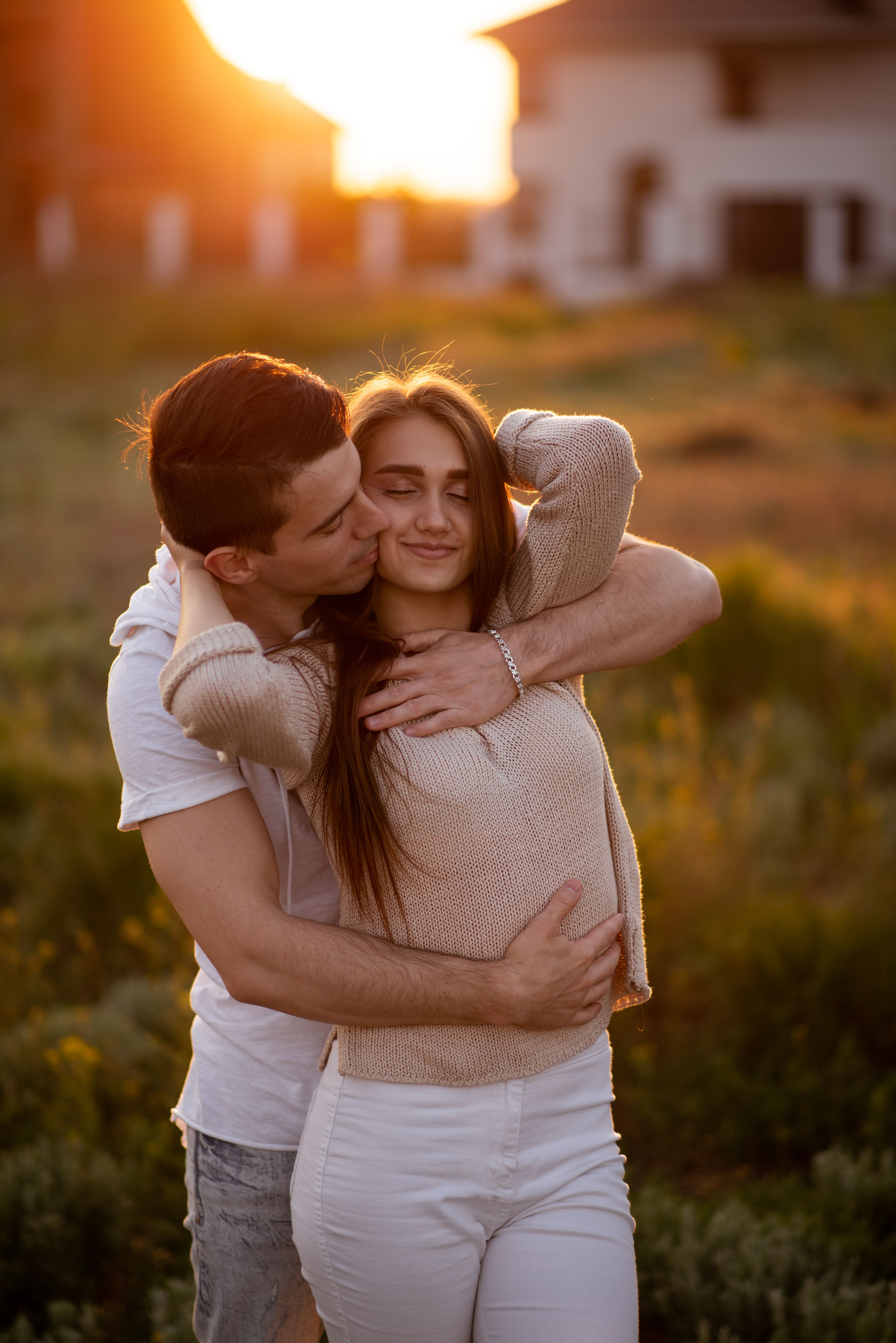 Young Couple Embracing Outdoors at Night · Free Stock Photo