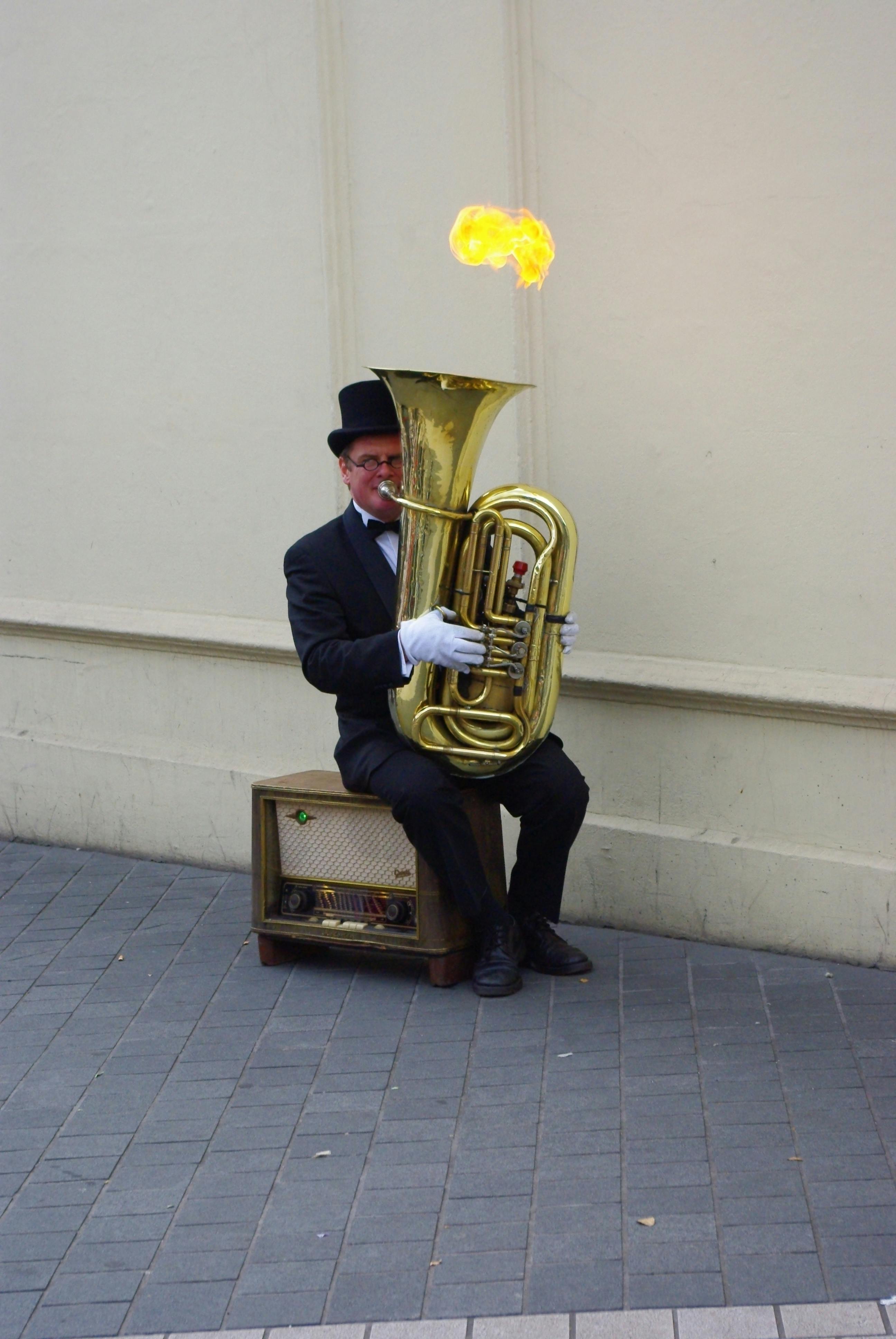Street Musician with Flaming Tuba · Free Stock Photo