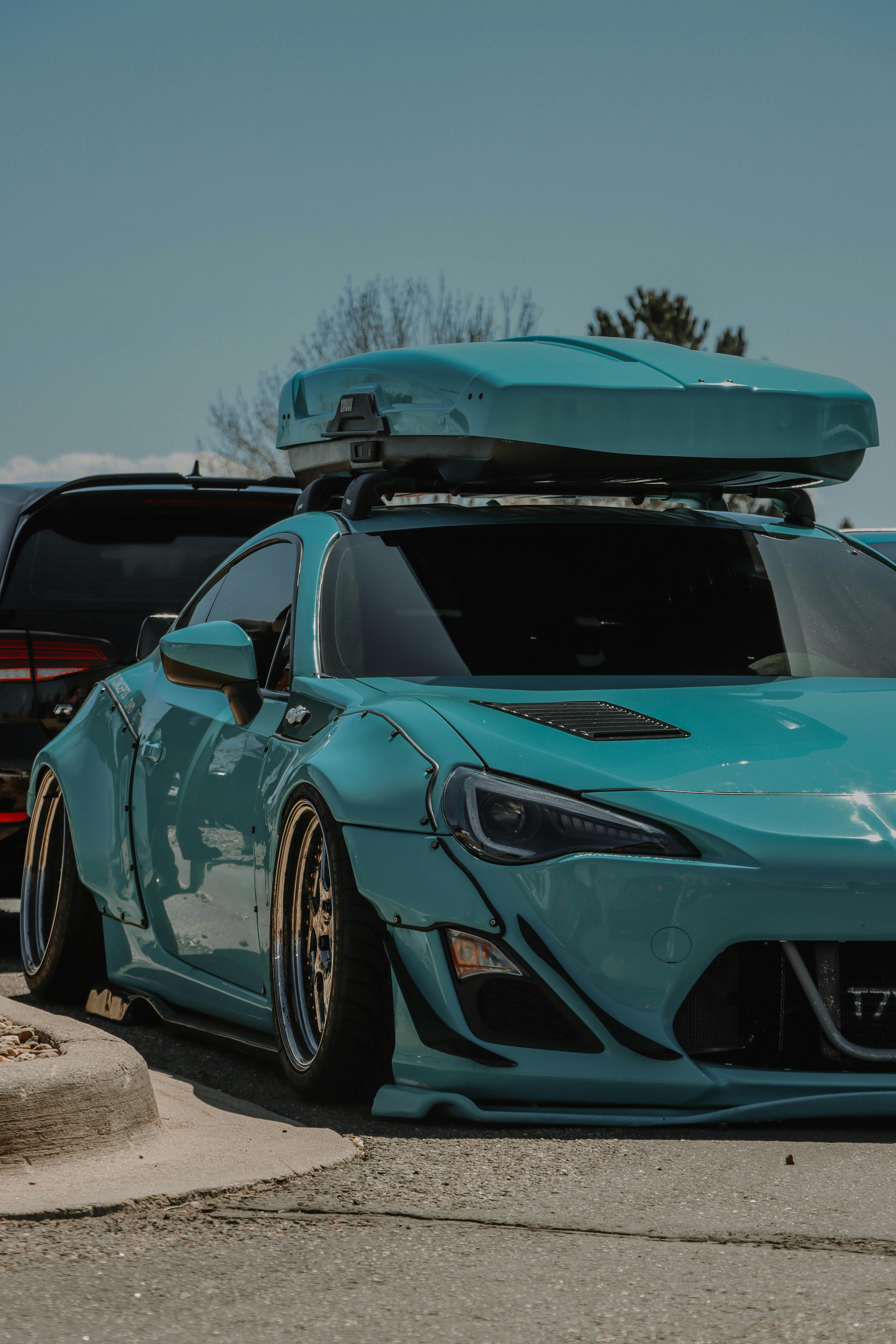 Customized Teal Sports Car in Denver Street · Free Stock Photo