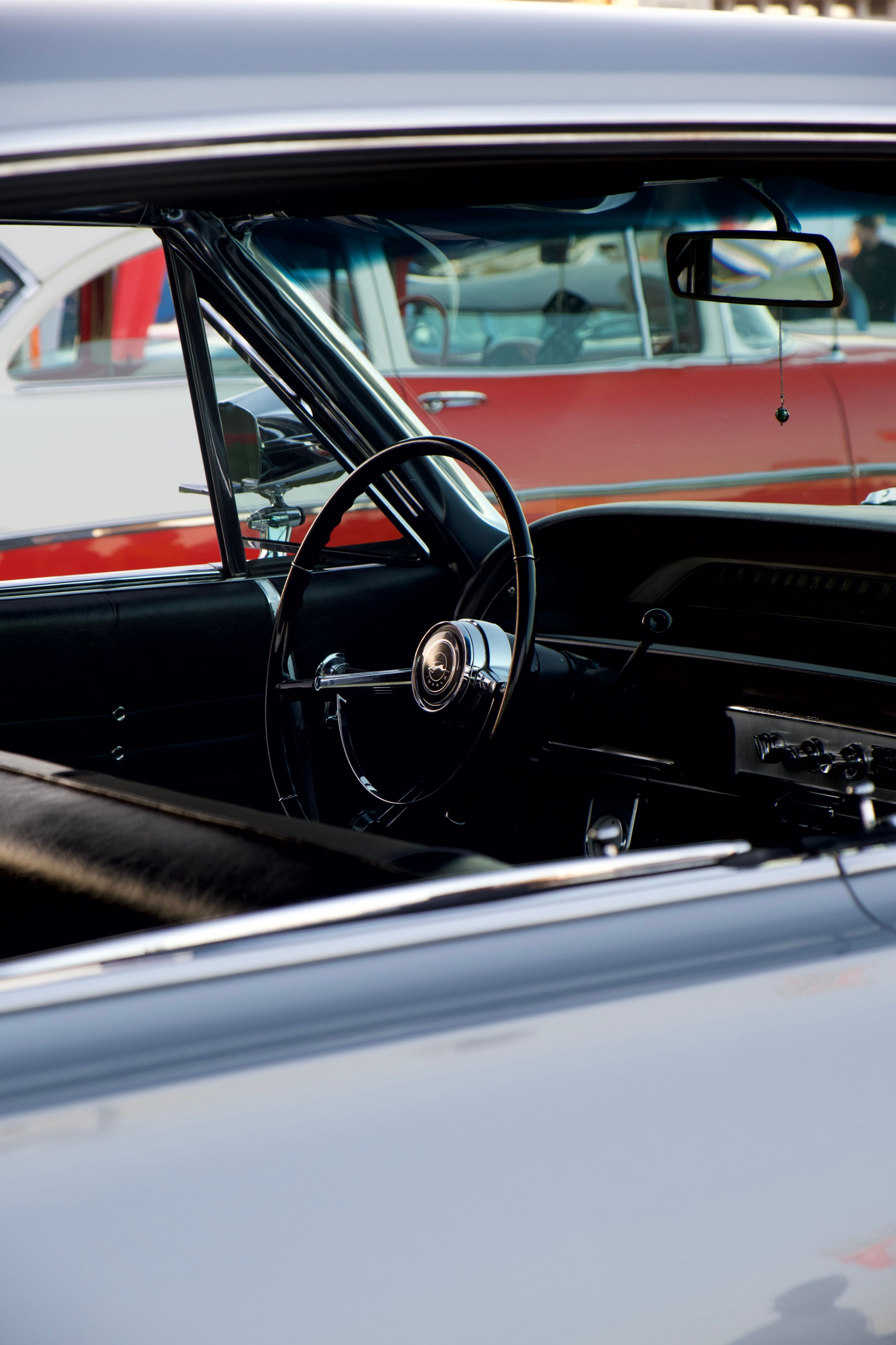 Black Classic Car Inside Well Lighted Room · Free Stock Photo