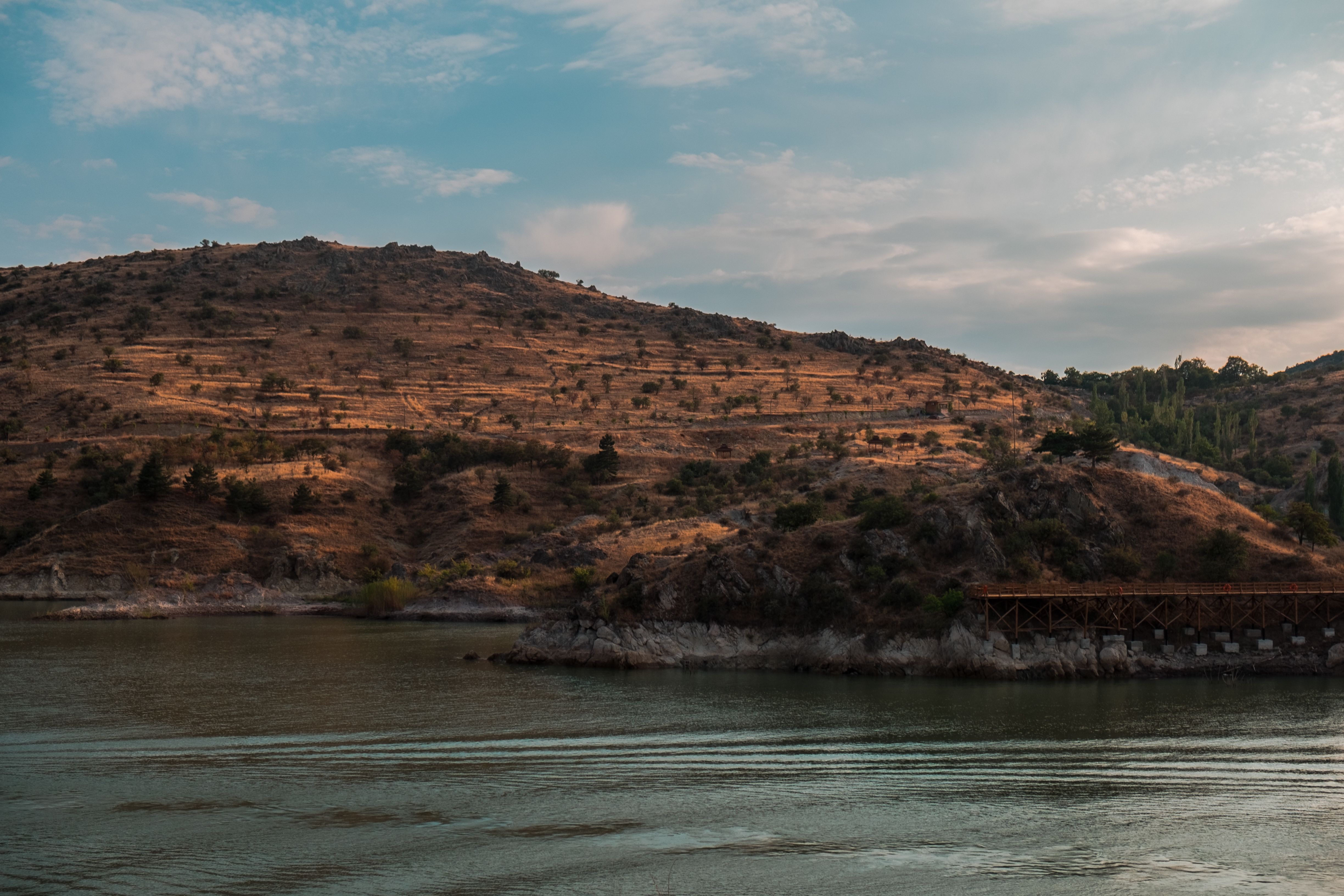 Arid Hill over Lake · Free Stock Photo