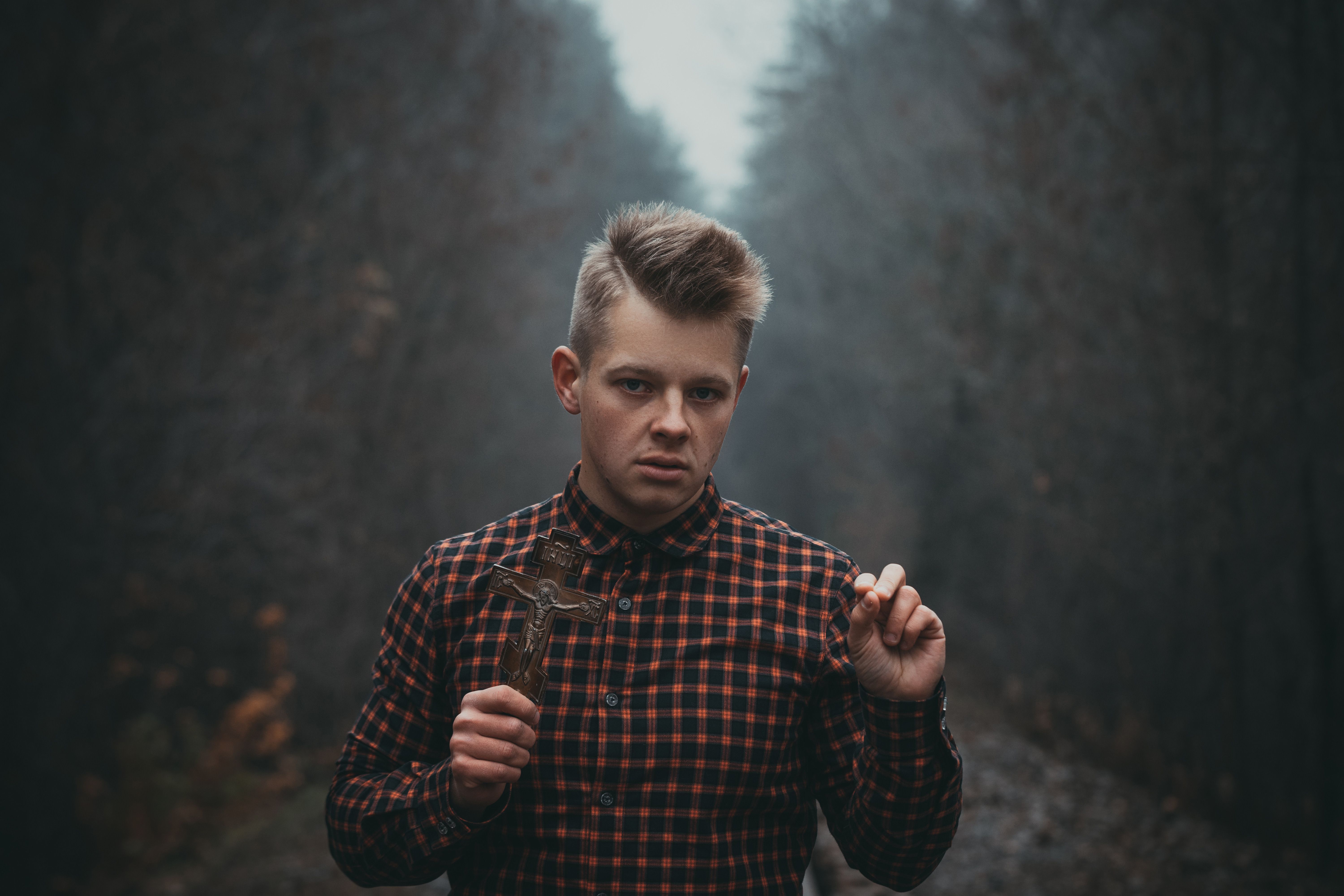 Man with Cross on Footpath through Forest · Free Stock Photo