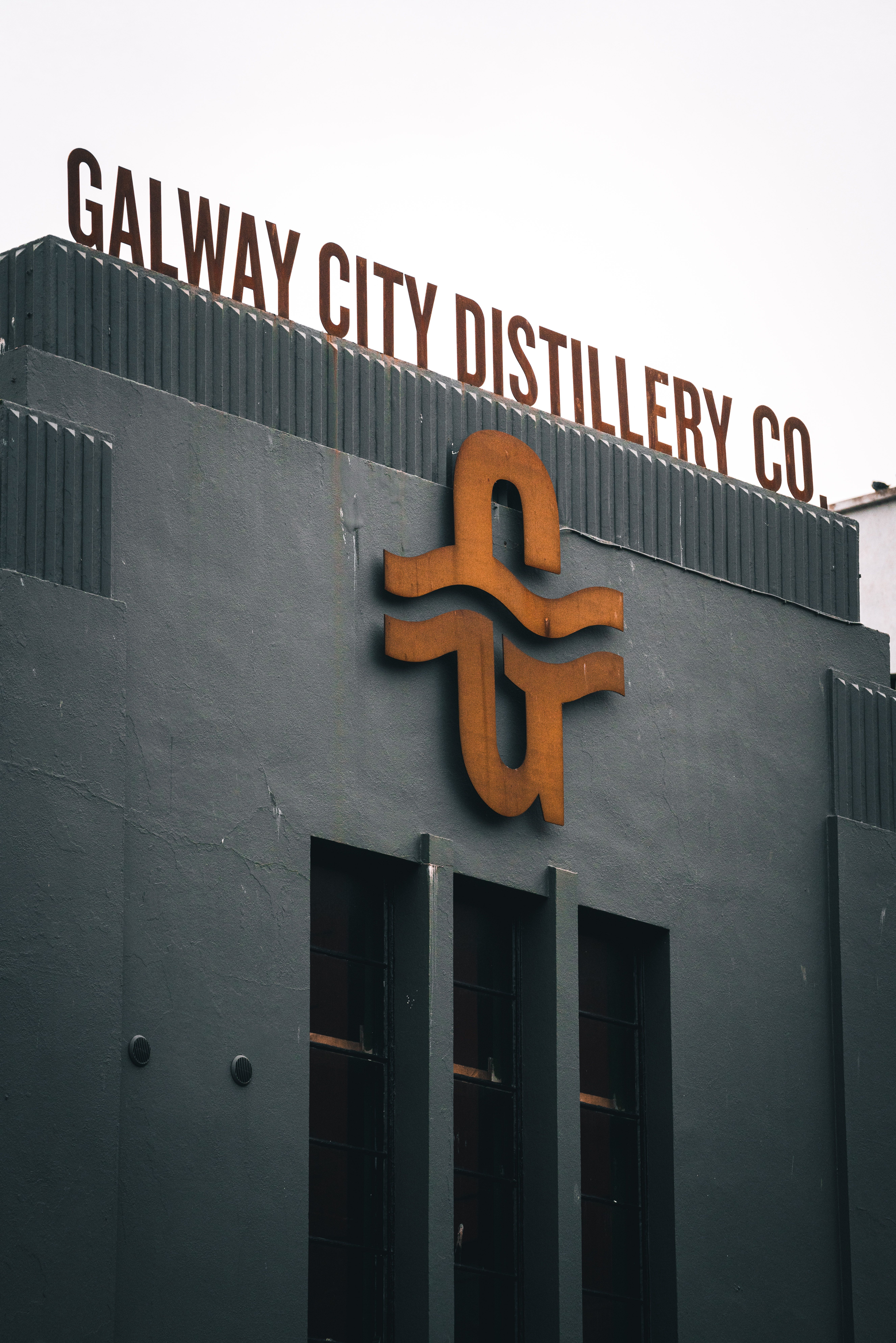 Sign and Logo on Fabric Building · Free Stock Photo
