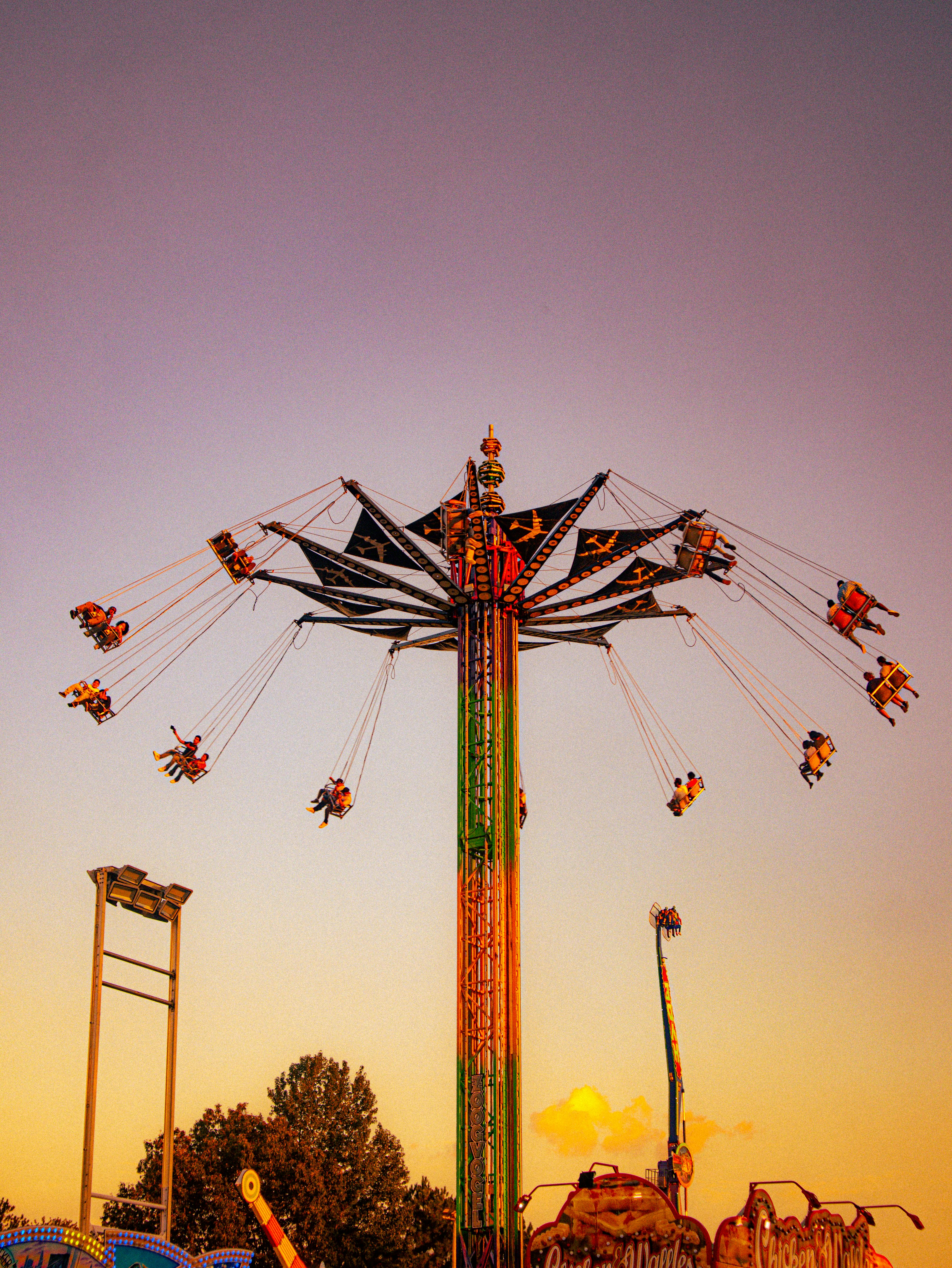 People on Swing ride at dusk · Free Stock Photo