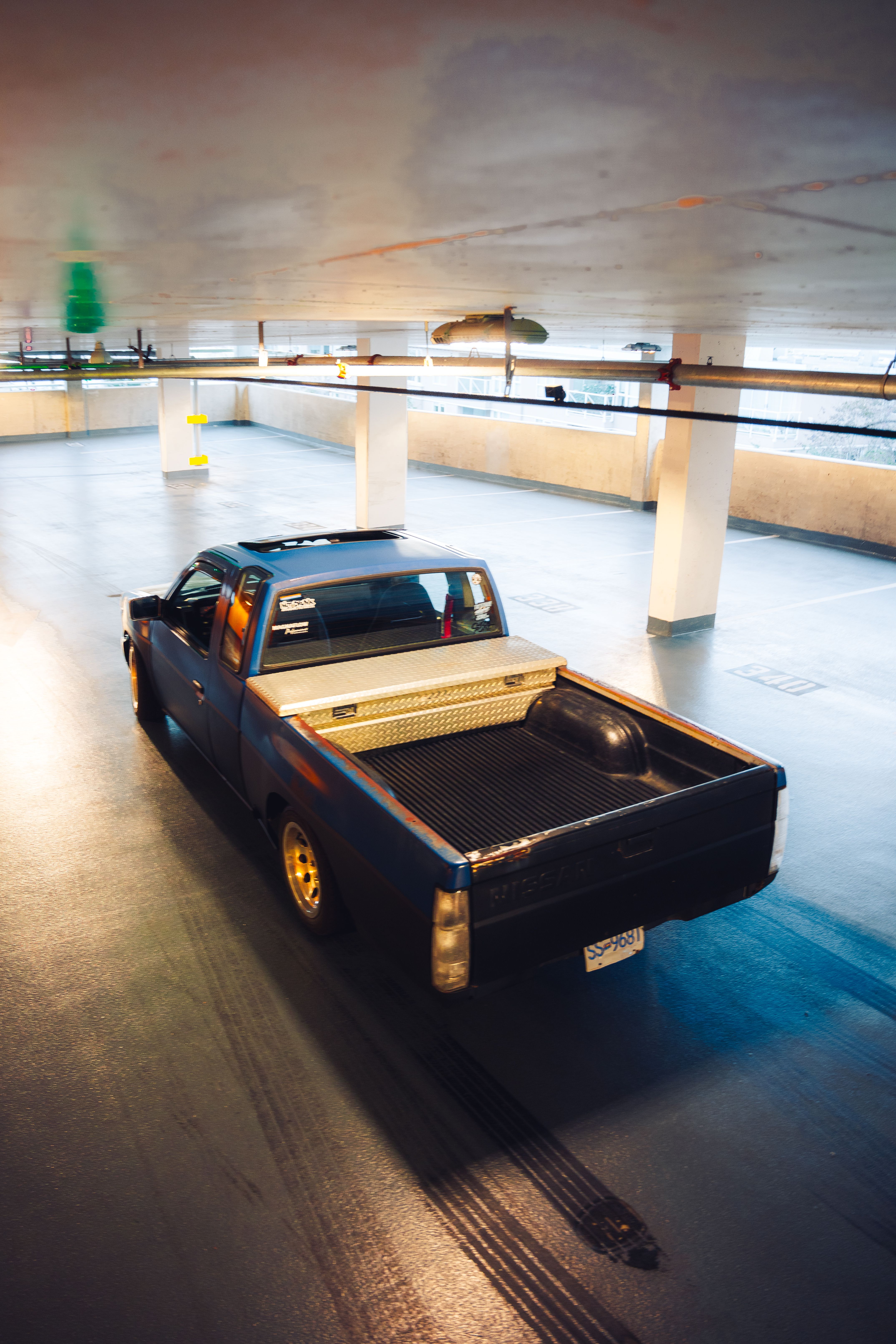 A Nissan Truck in a Garage · Free Stock Photo