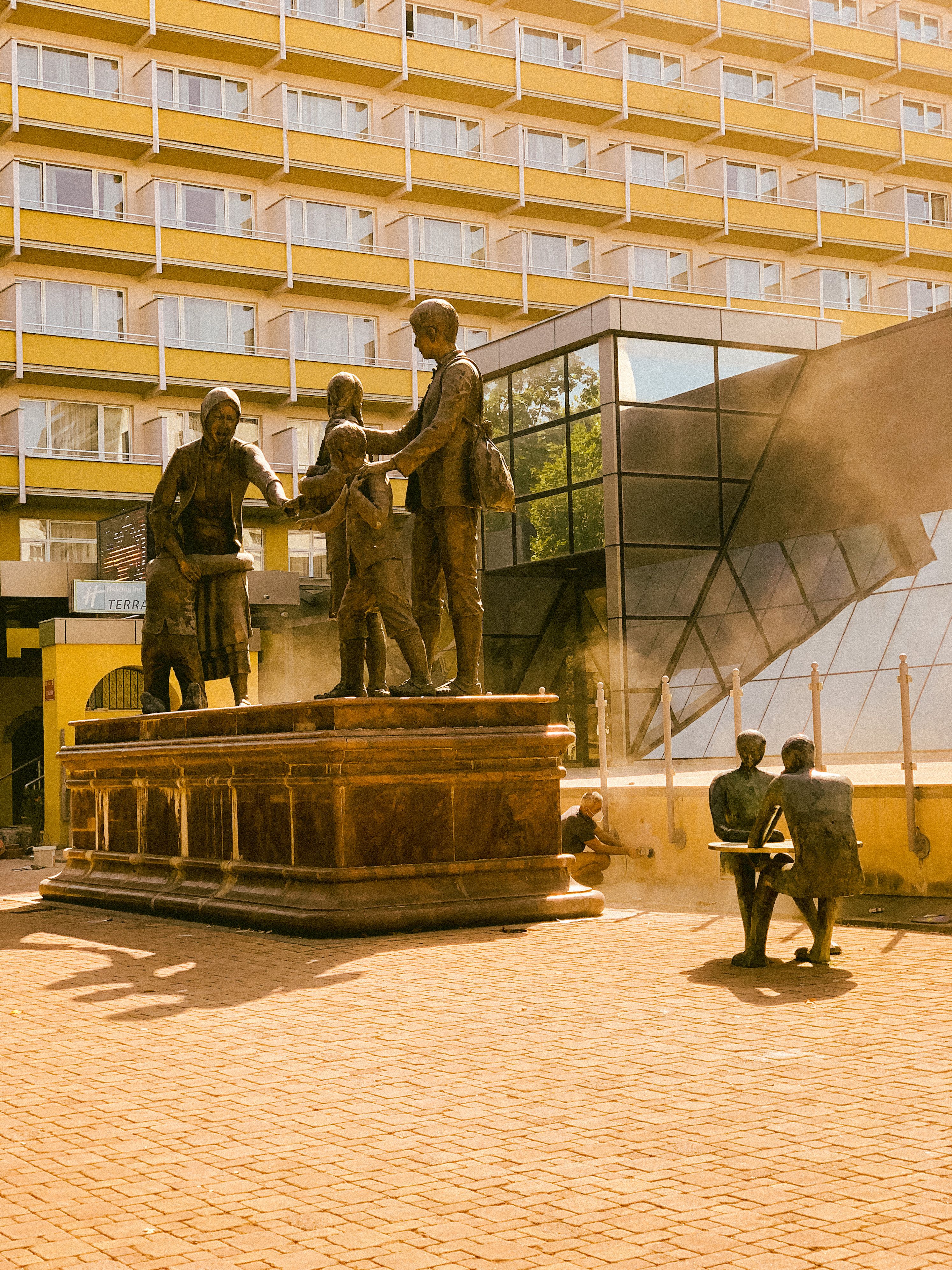 Yellow Toned Image of a Modernist Building and a Bronze Monument · Free ...