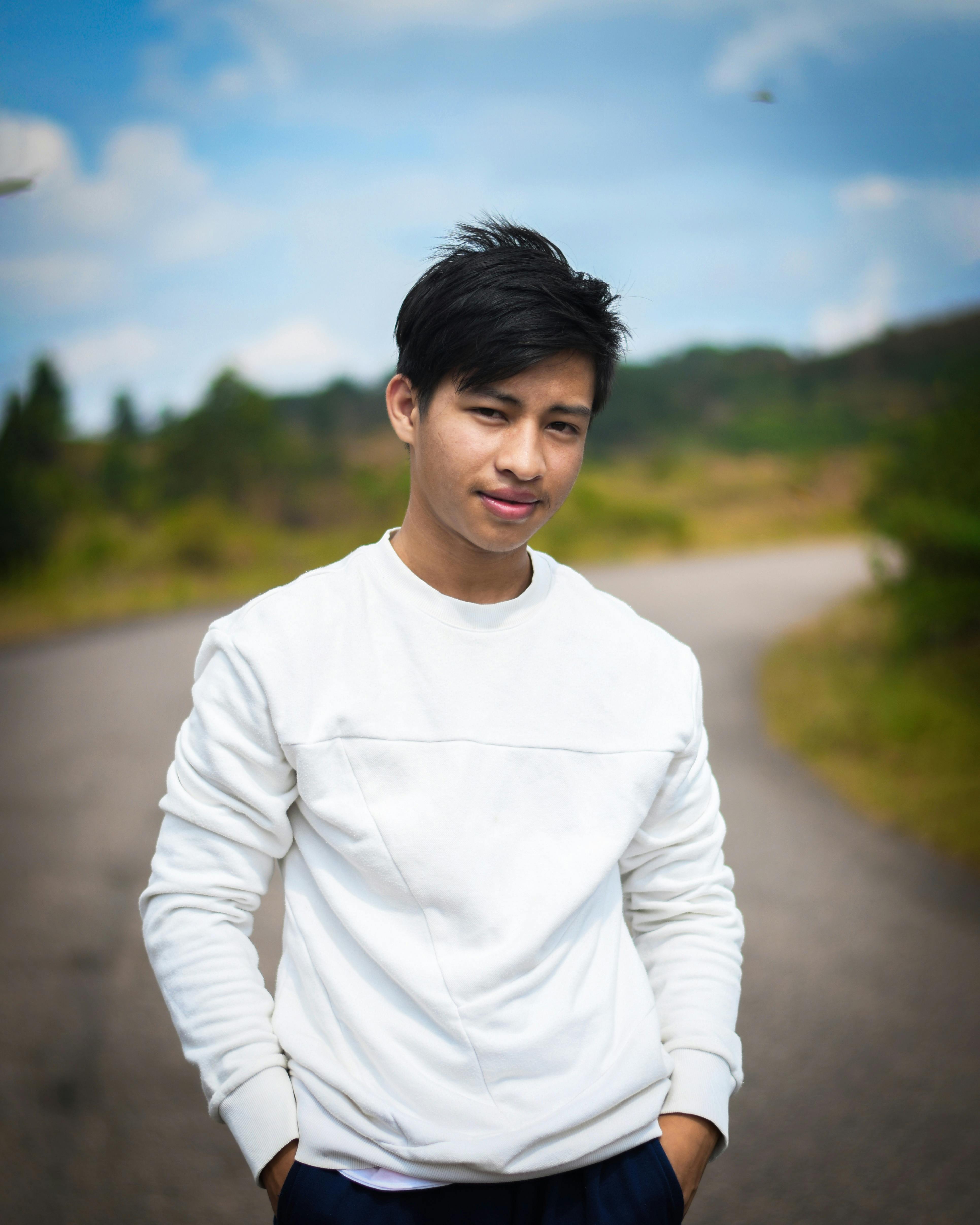 Man Photographing Roots of a Large Tree Arching Over a Footpath · Free ...