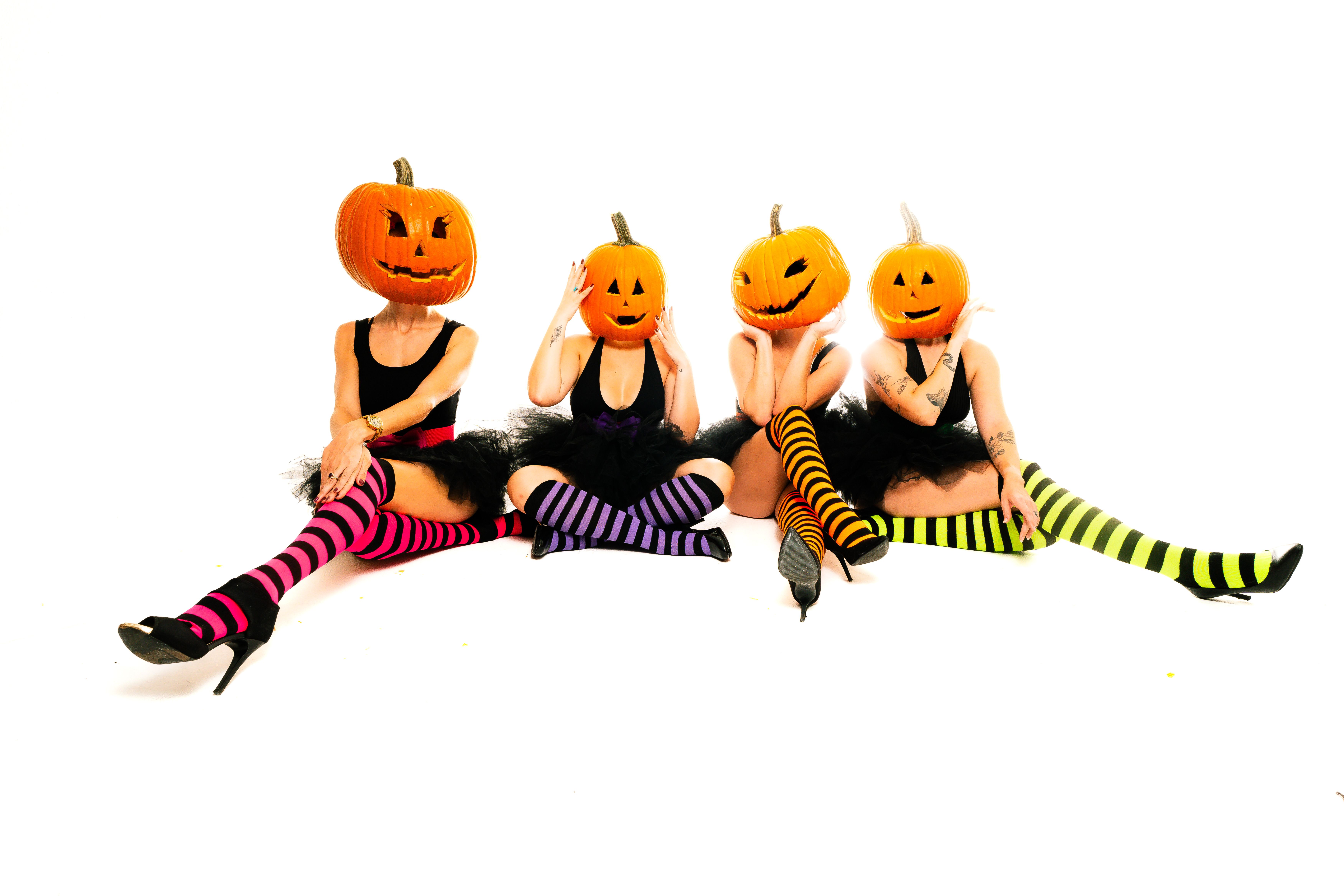 Women with Pumpkin Masks on Head Posing in Studio · Free Stock Photo