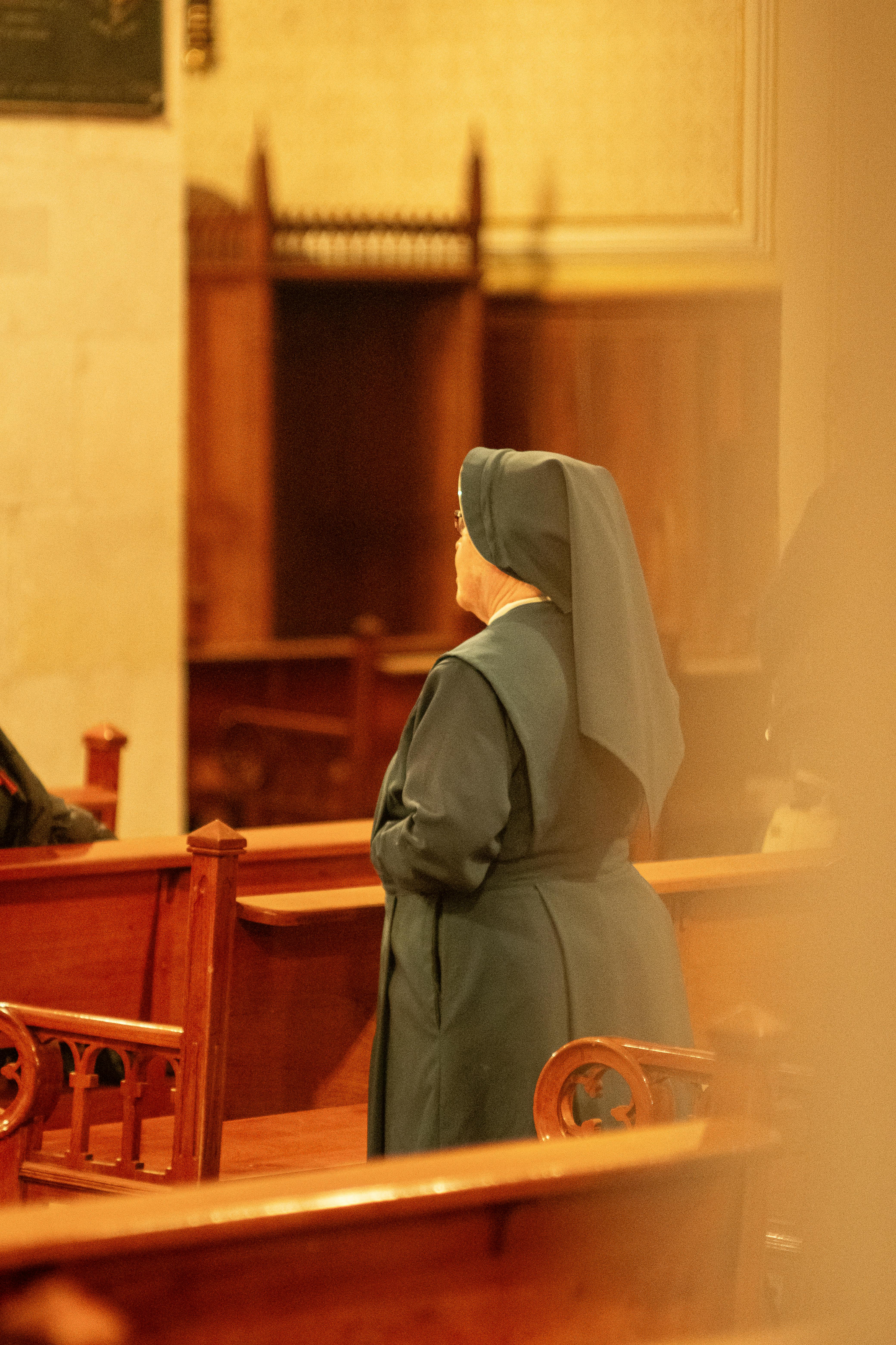 Nun Praying in Church · Free Stock Photo