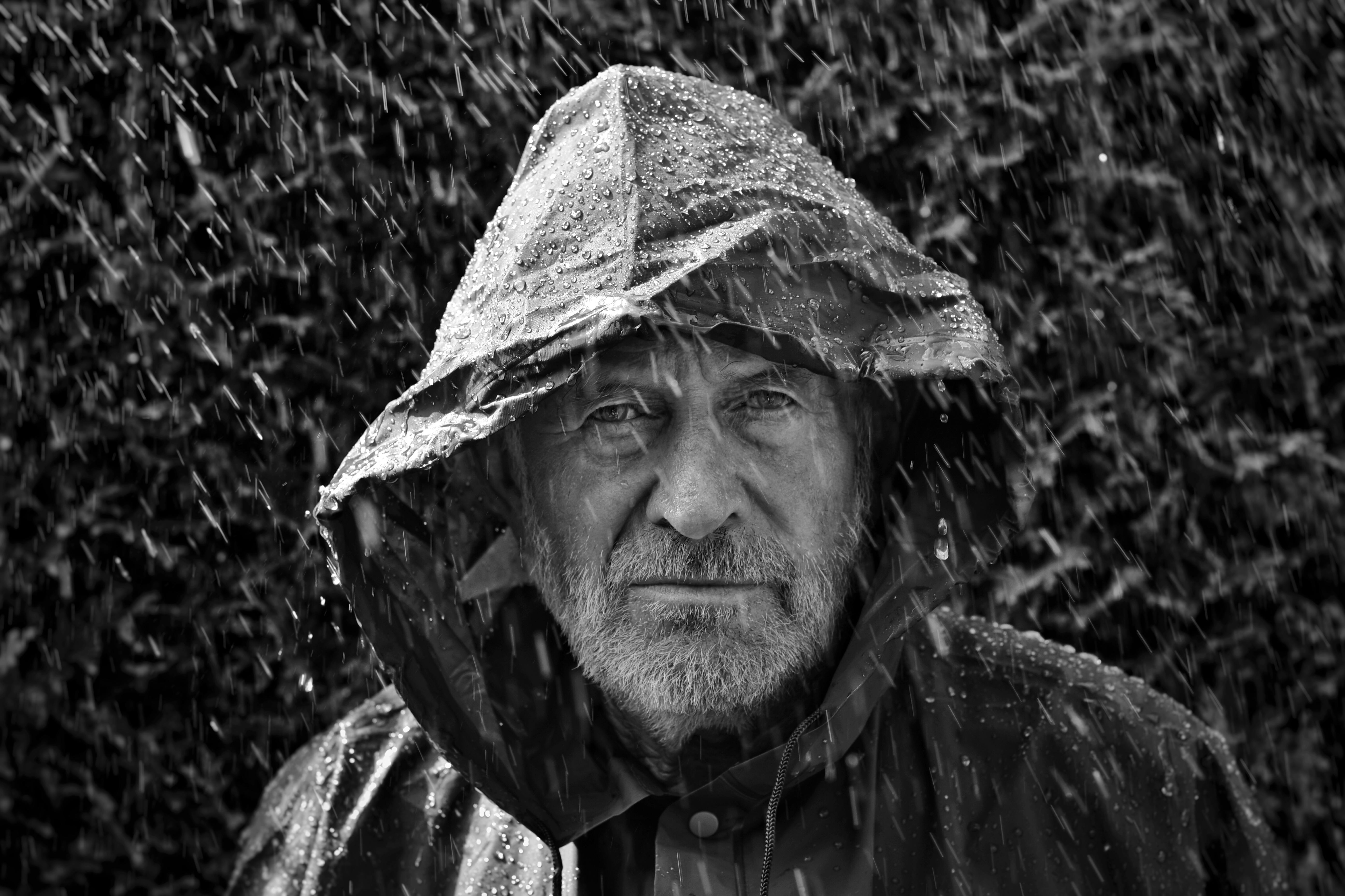 Portrait of a Hooded Man Standing in Rain · Free Stock Photo
