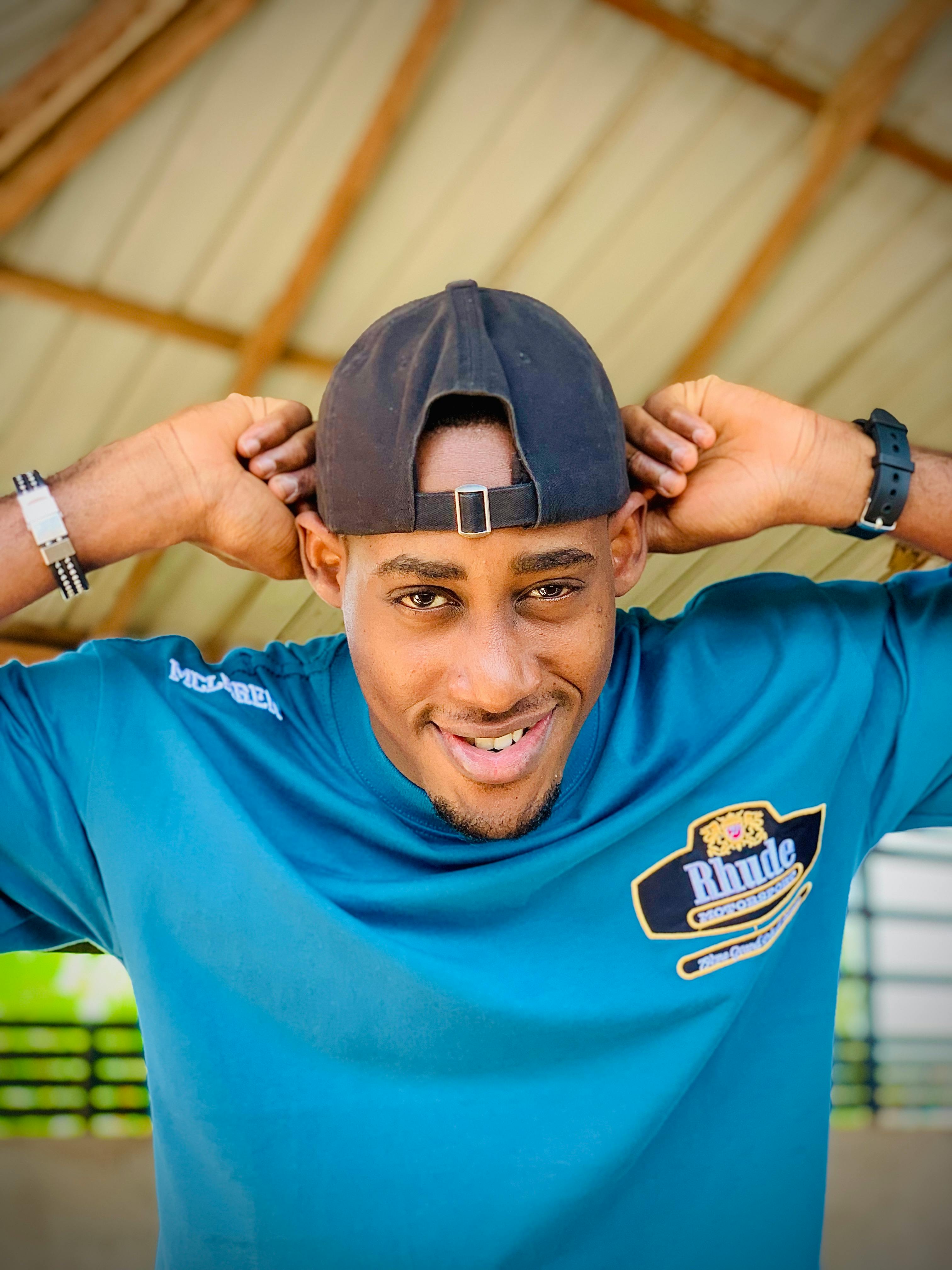 Person in Cap Looking Up · Free Stock Photo