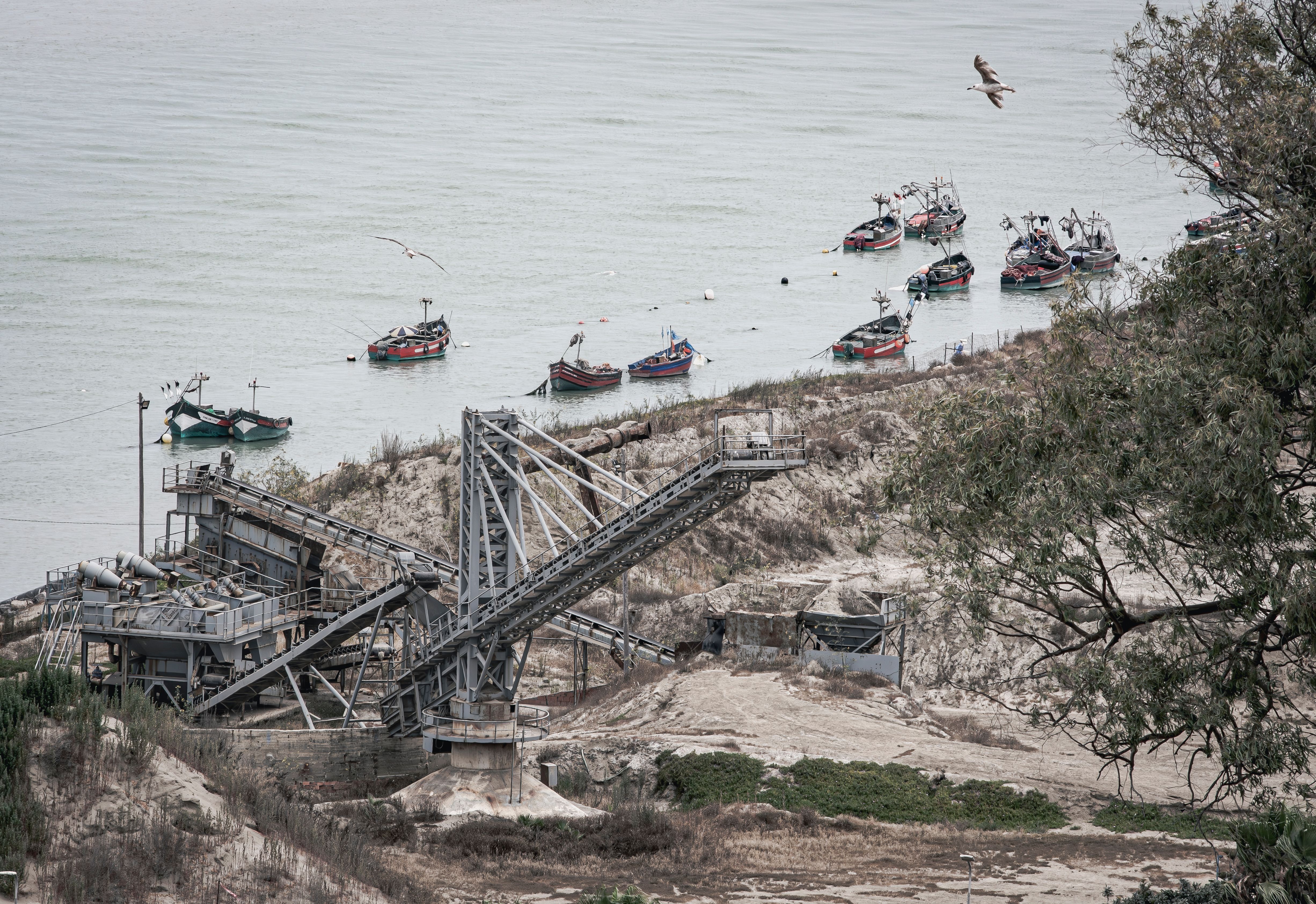 Steel Construction by Mine Entrance on Sea Shore · Free Stock Photo