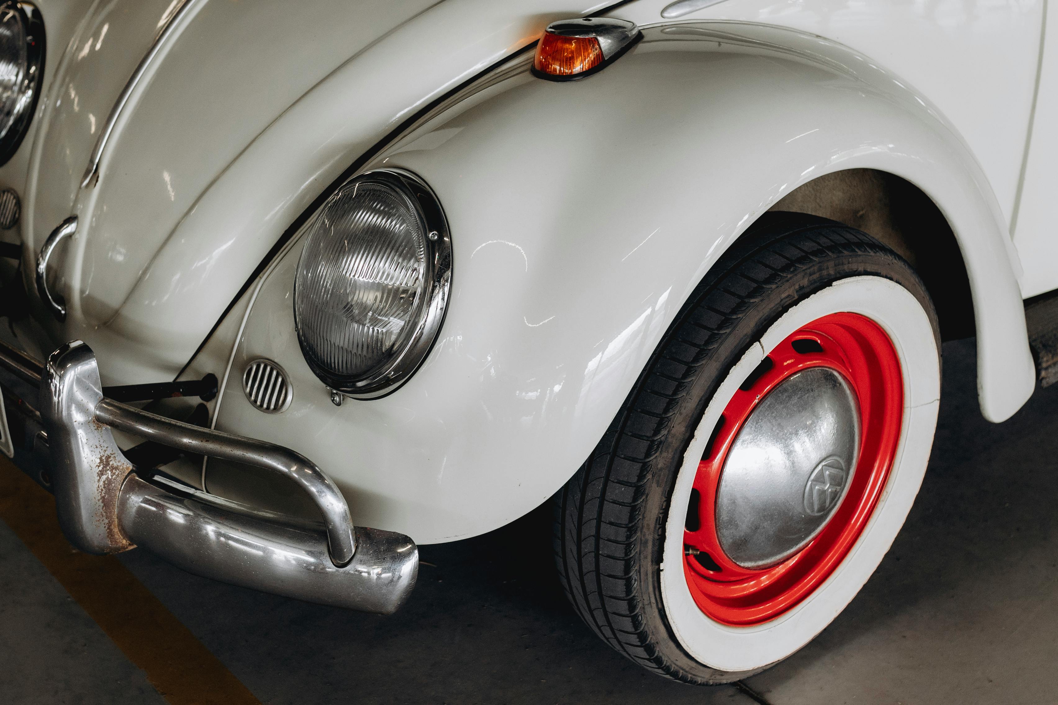 White Volkswagen Beetle Car with Red and White Wheel Rim · Free Stock Photo
