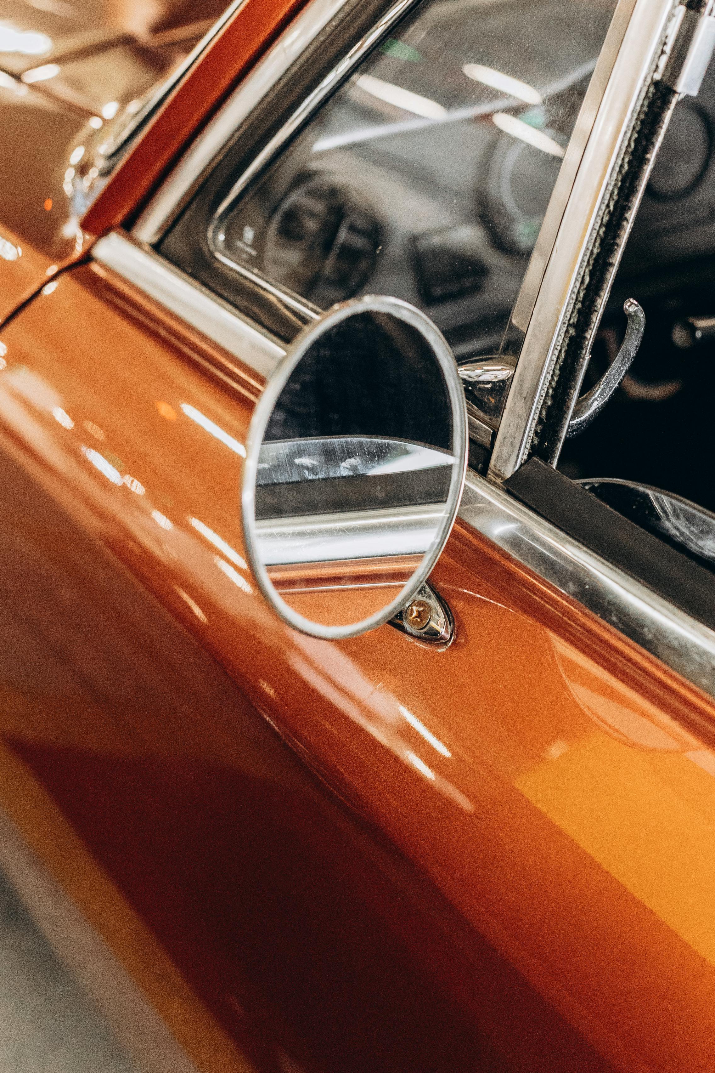 Reflection of a Woman from the Side Mirror of a Car · Free Stock Photo