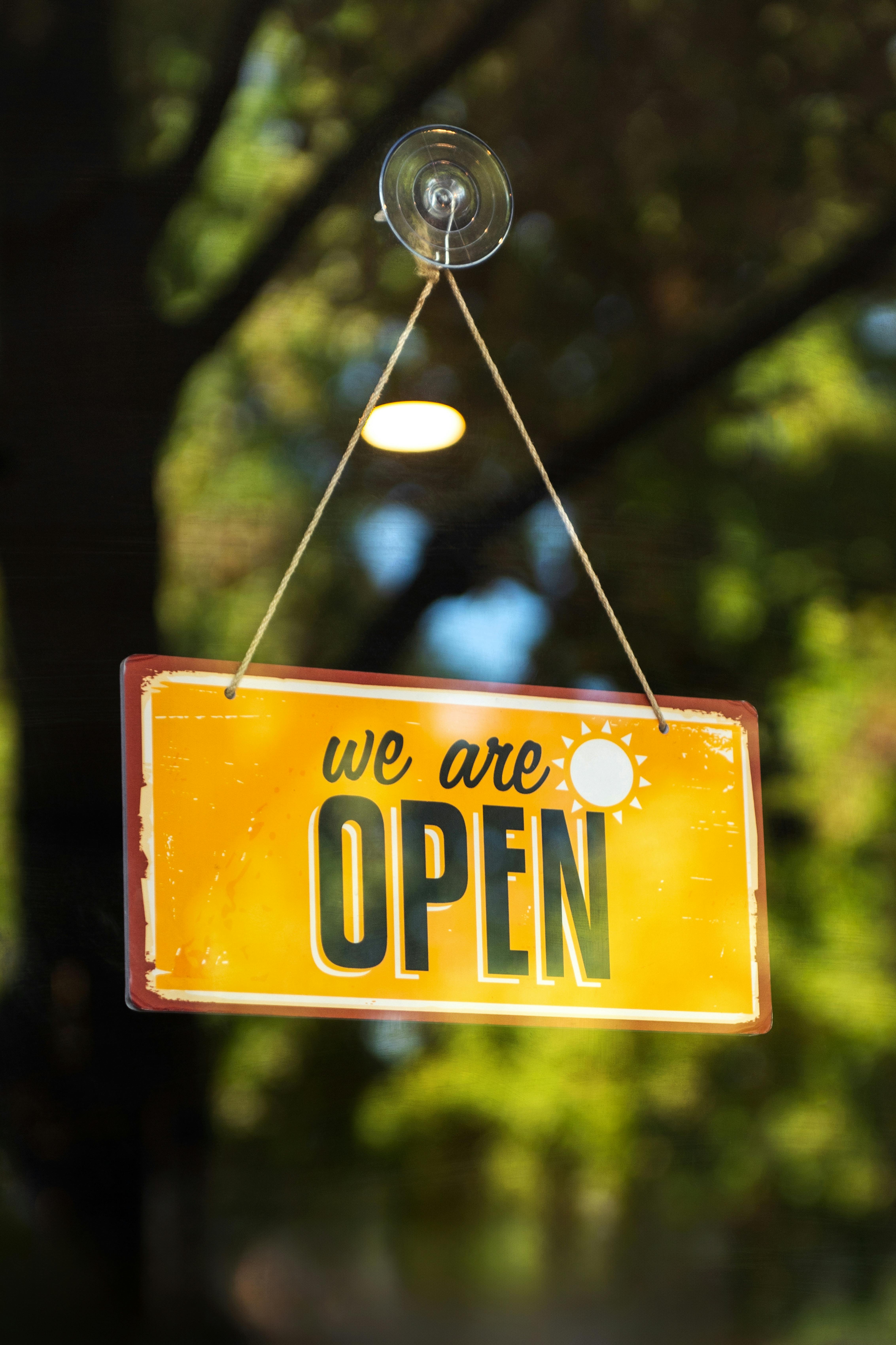 Open Sign Hanging on Window Glass · Free Stock Photo
