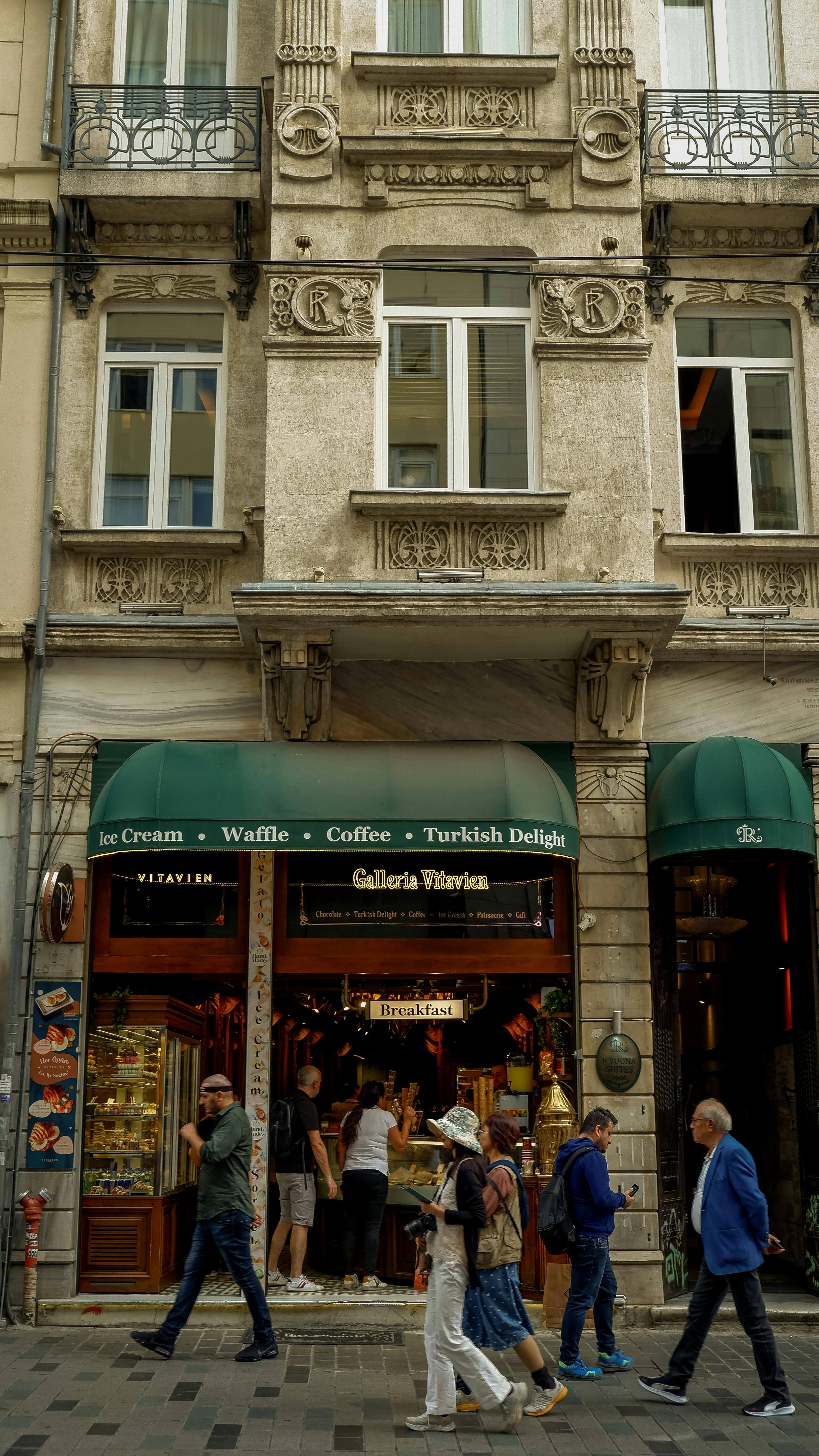 People Walking by Store in Townhouse · Free Stock Photo