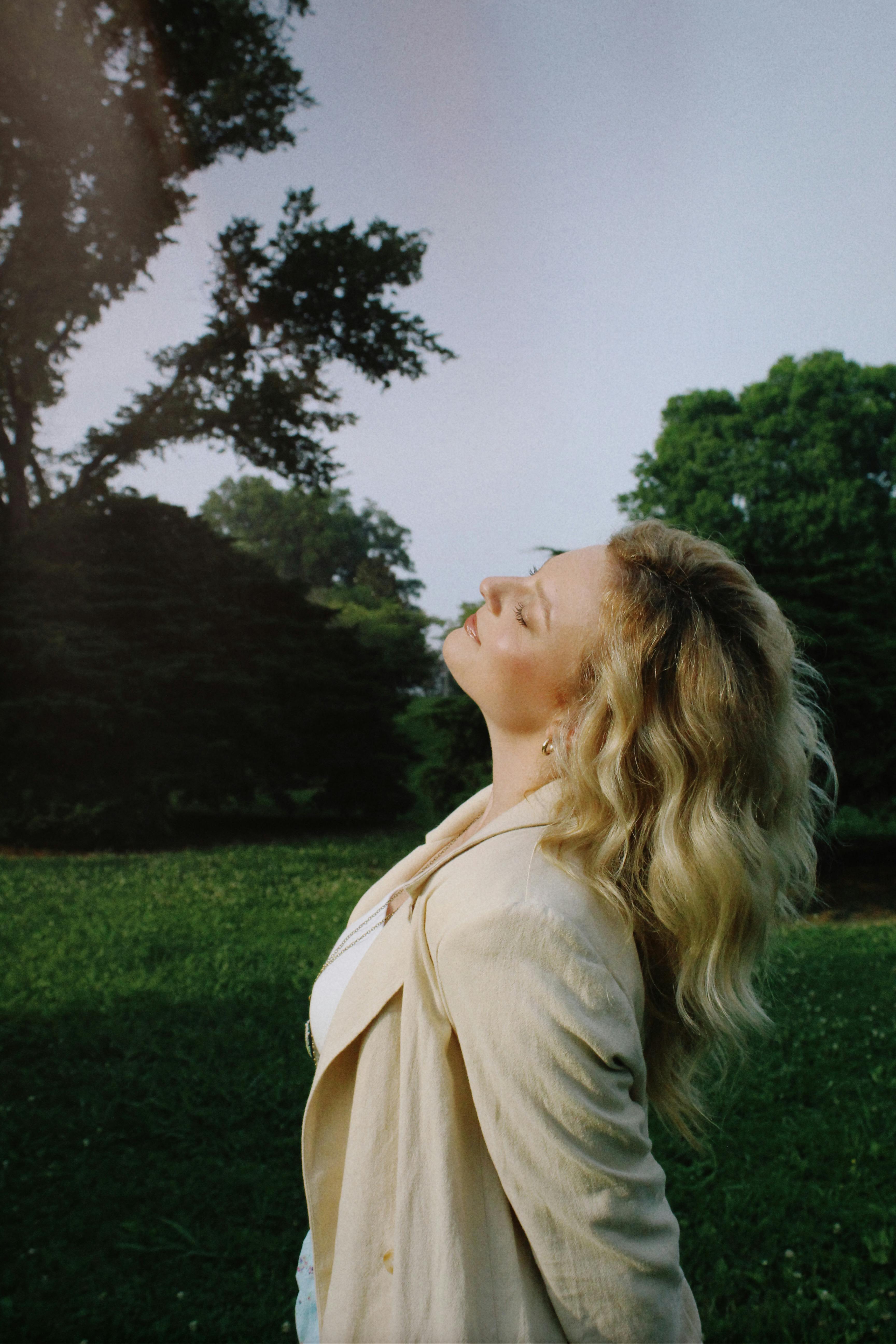 Blonde Model with Eyes Closed · Free Stock Photo