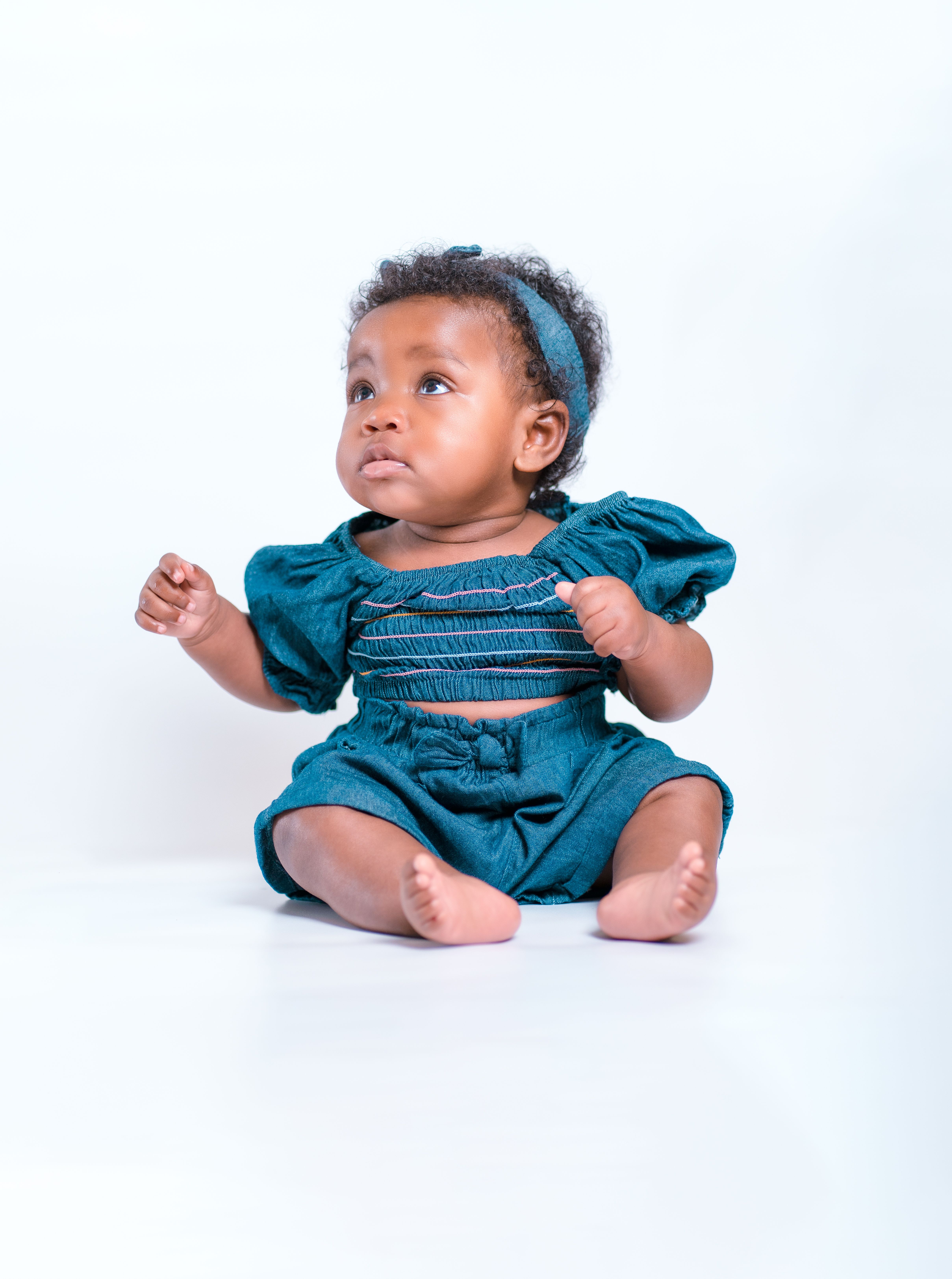 Portrait of a Baby Sitting · Free Stock Photo
