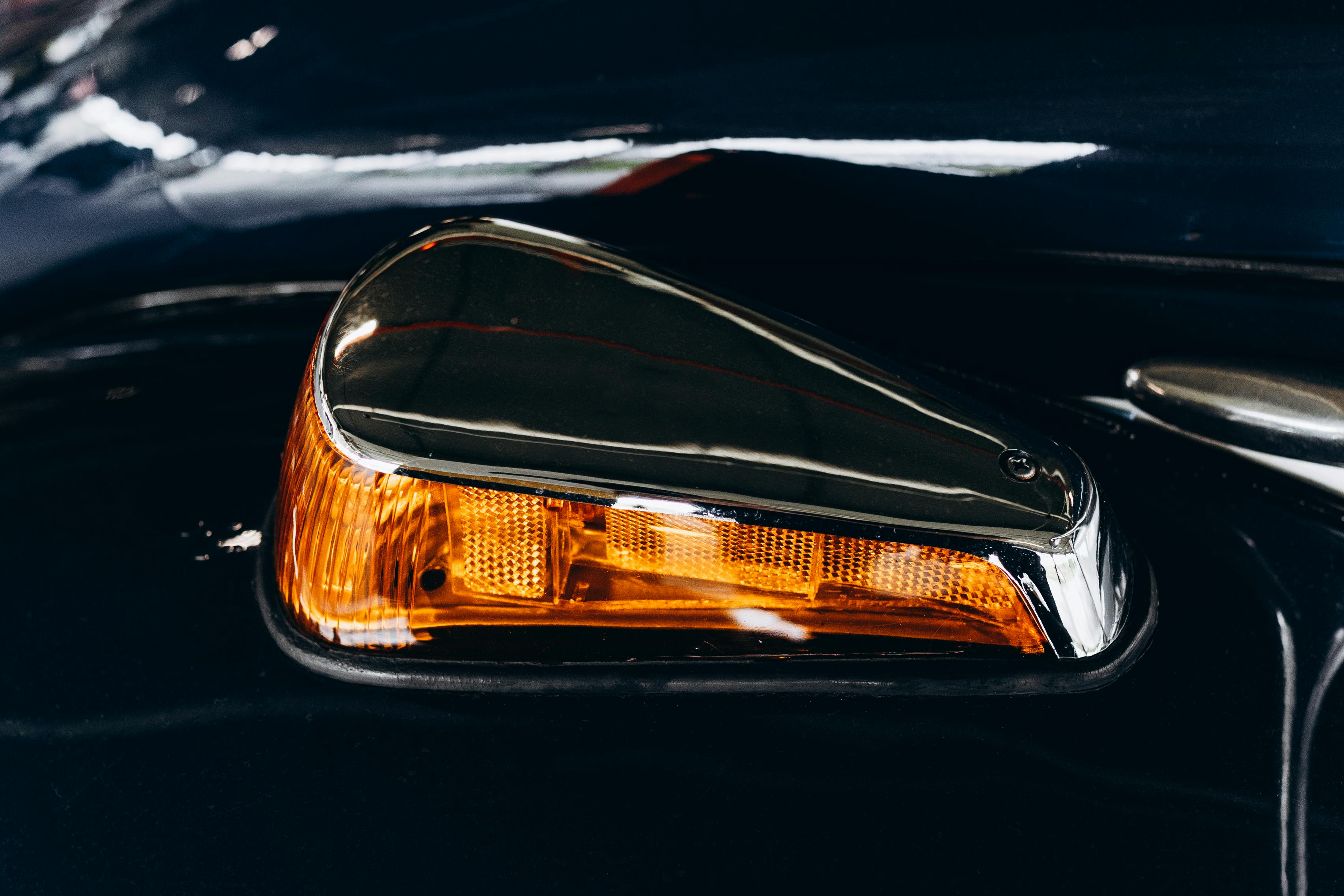Close-up on Turn Signal Light on Black Car · Free Stock Photo