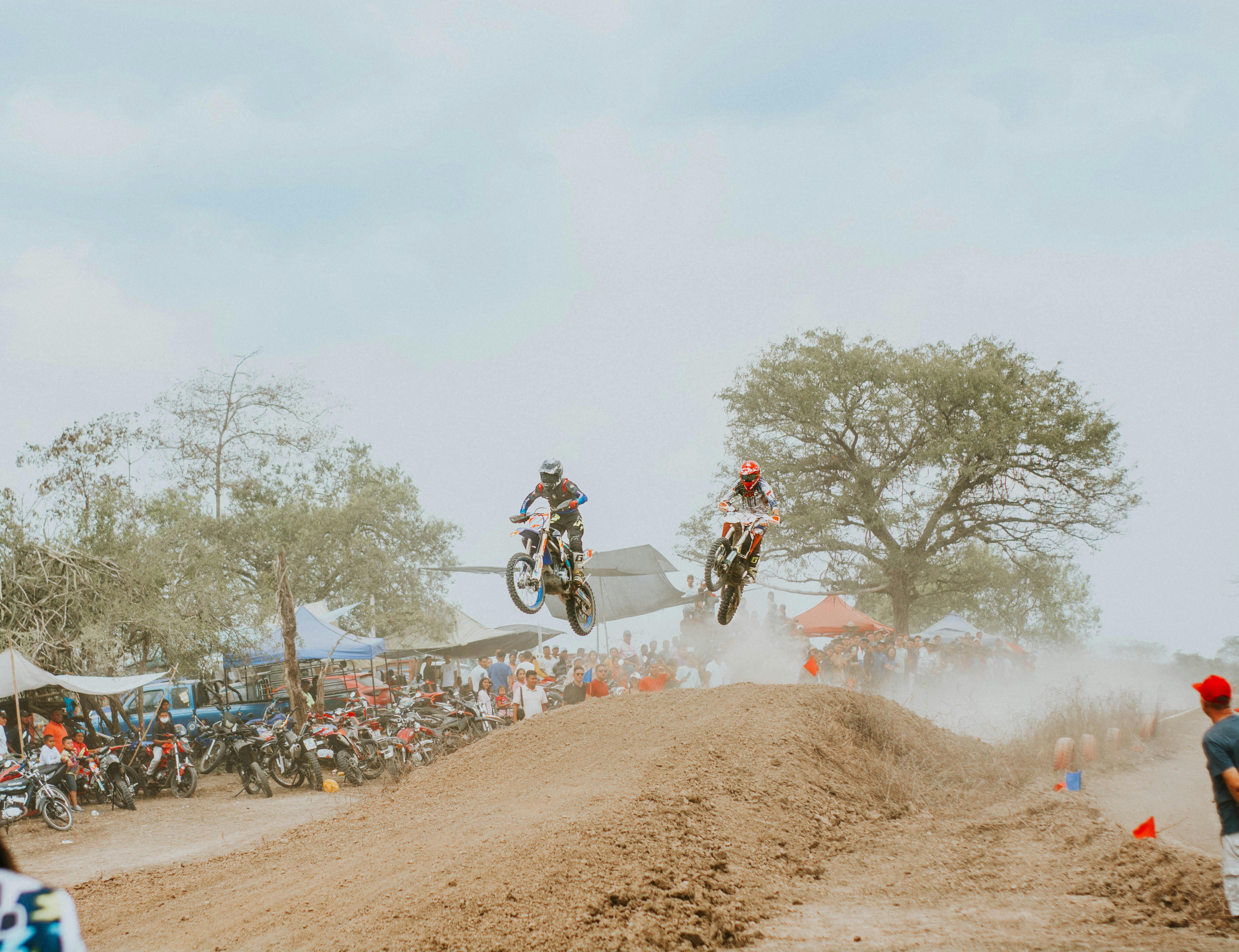 Motorcycle Midair aboce Dirt Ramp · Free Stock Photo